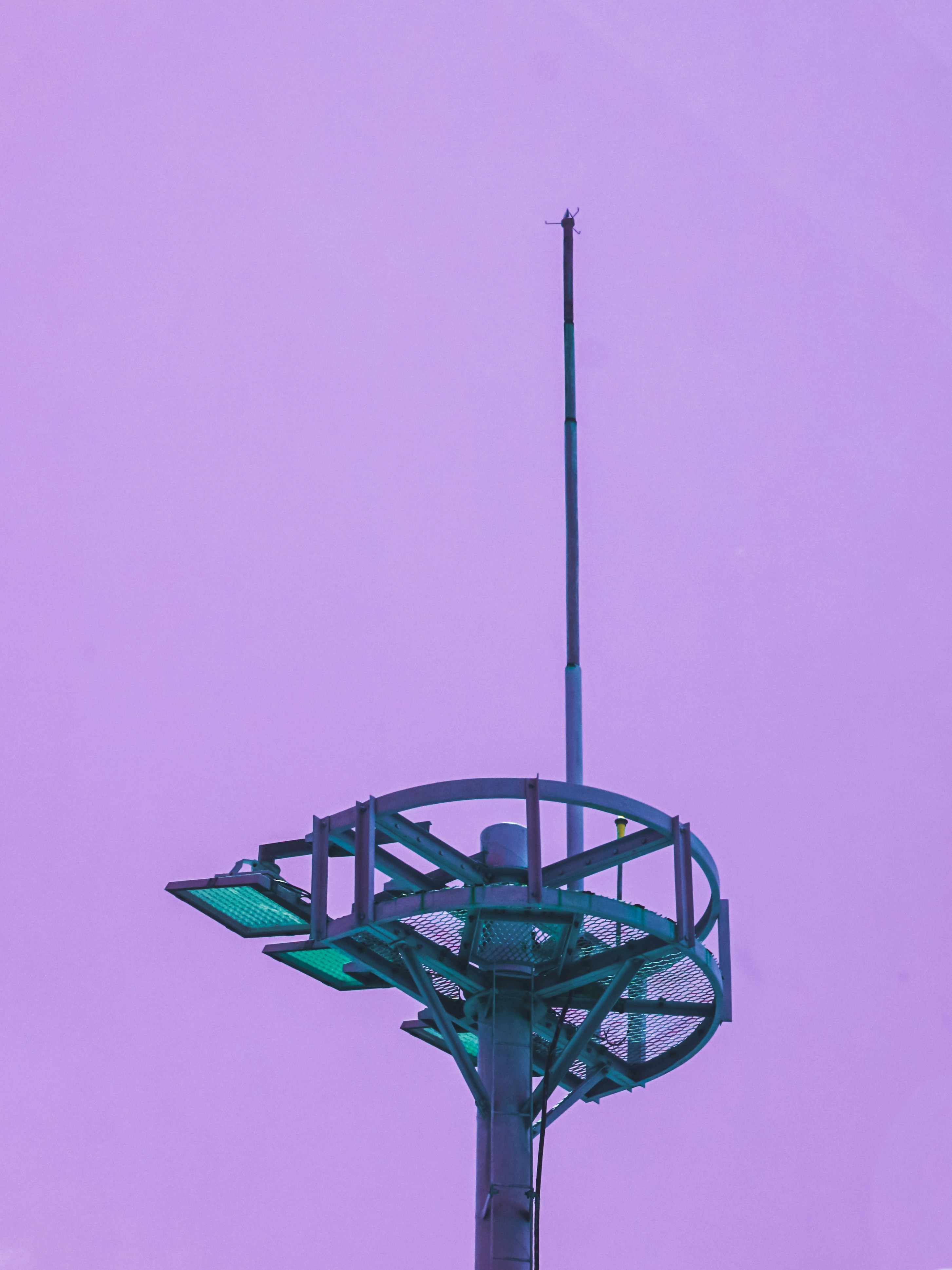 Vertical Sentinel: Antenna Crown Rising Over a Lavender Sky