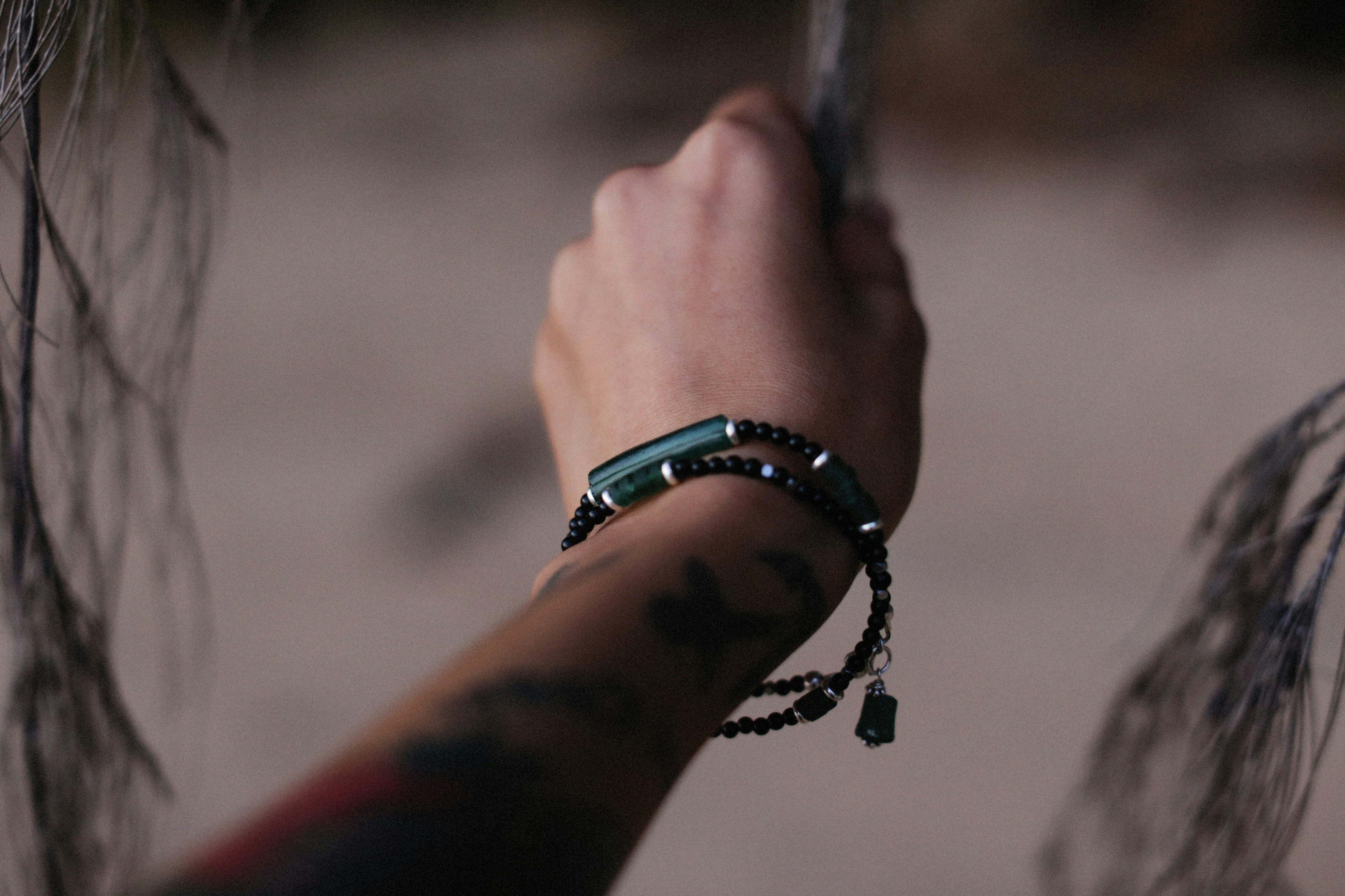 a person's arm with a bracelet on it