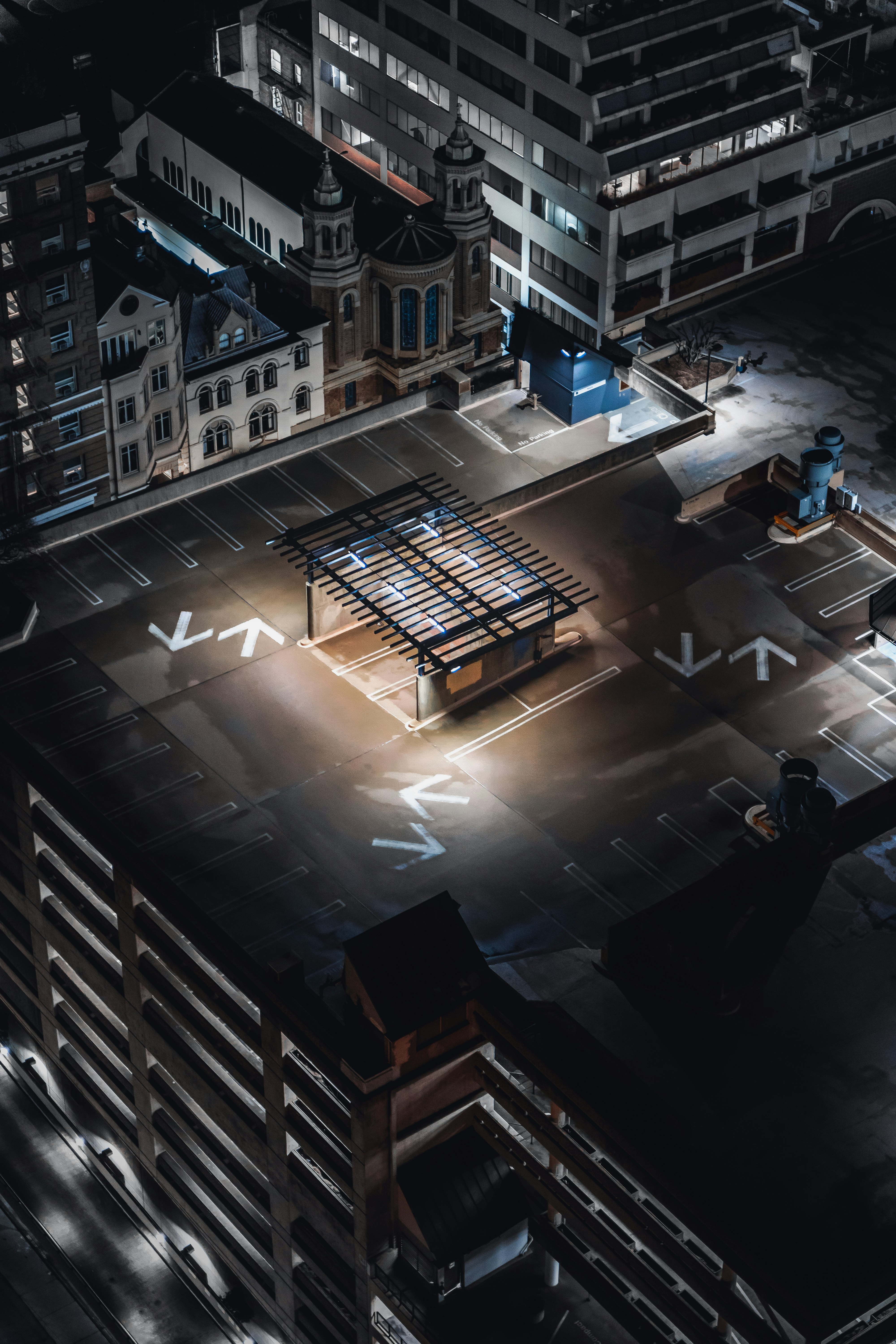 an aerial view of a parking lot at night