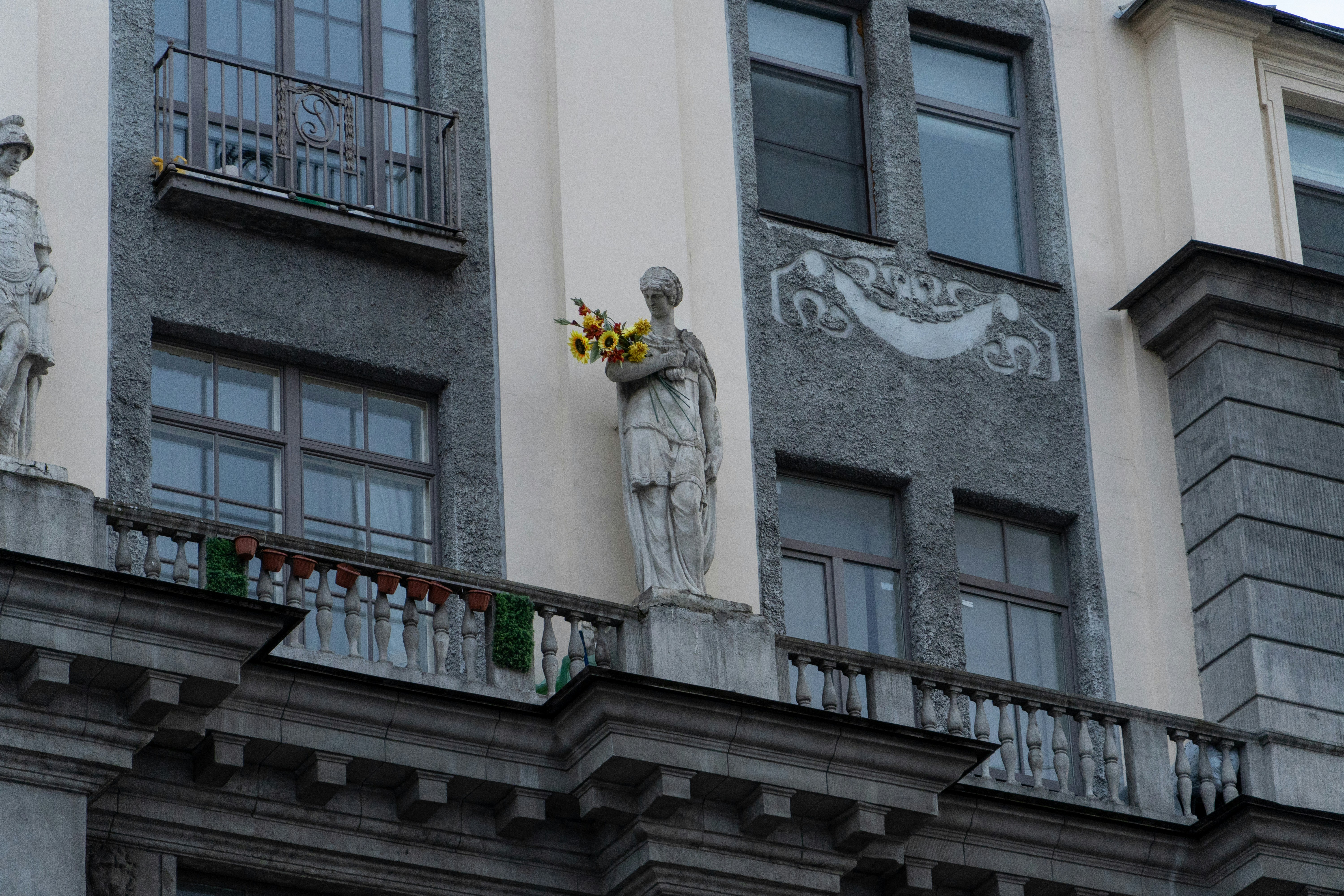 a building with statues on the side of it
