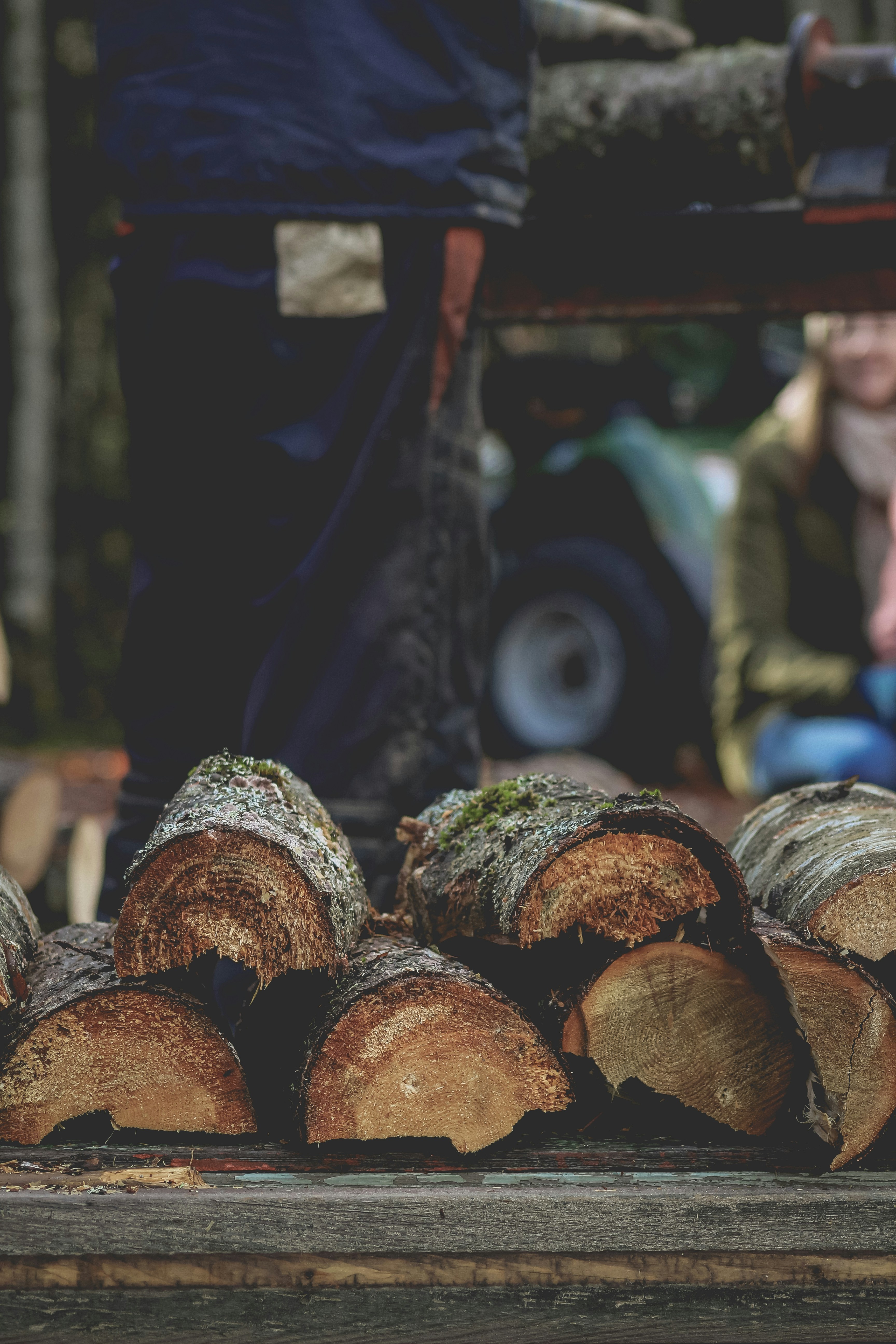 a pile of logs sitting on top of a wooden table