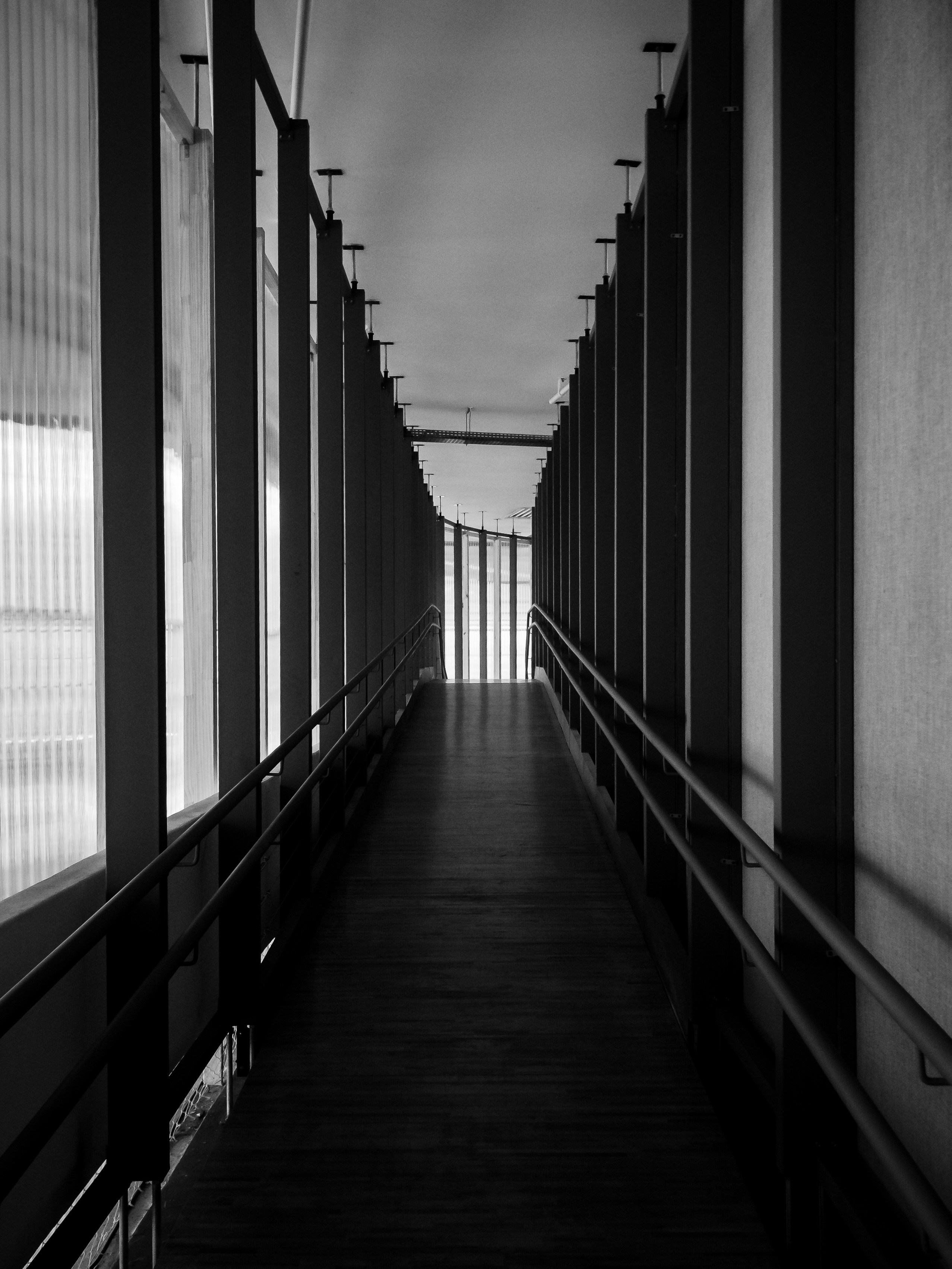 A black and white photo of a long hallway photo – Free Black Image on ...
