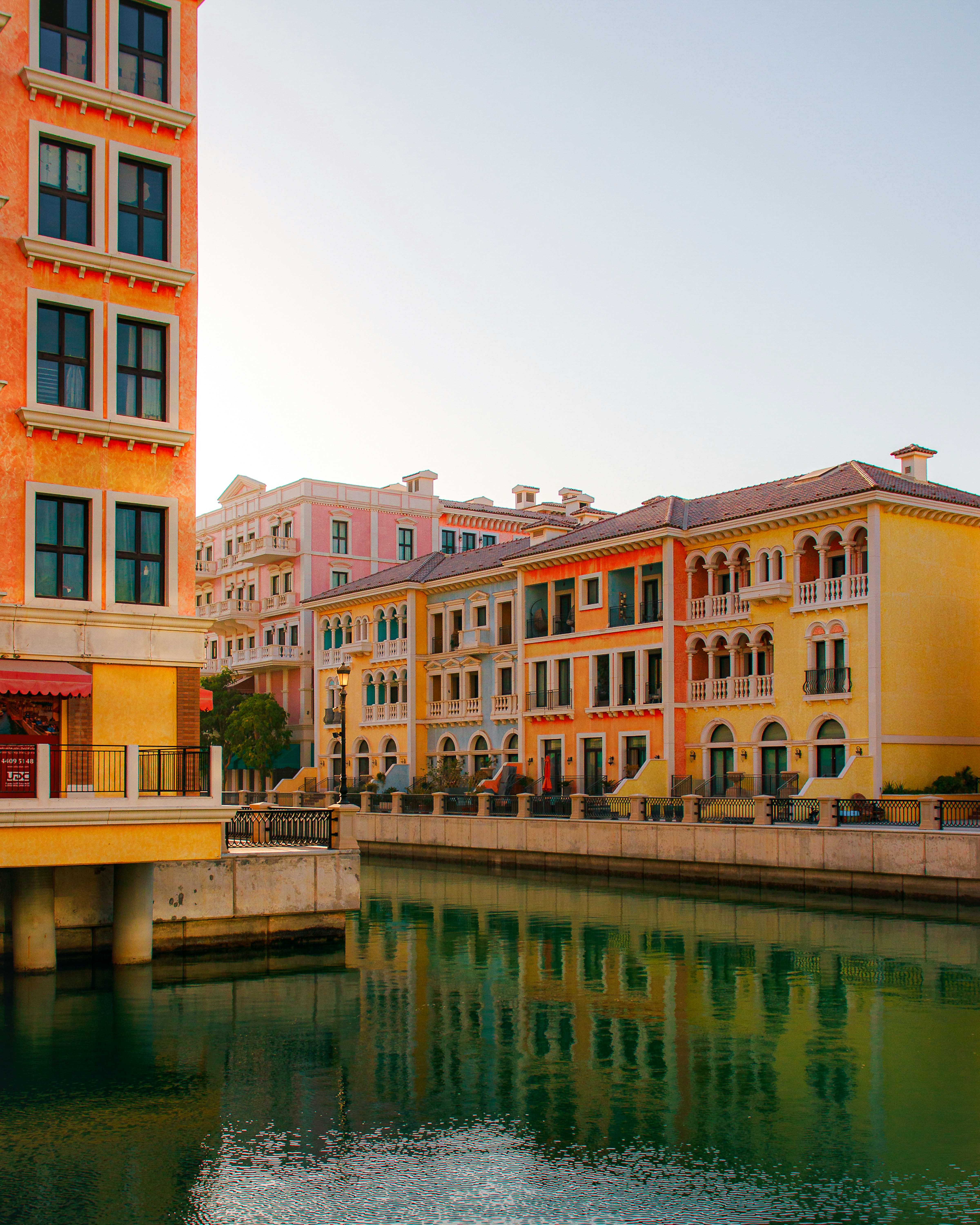 A river running through a city next to tall buildings photo – Free ...