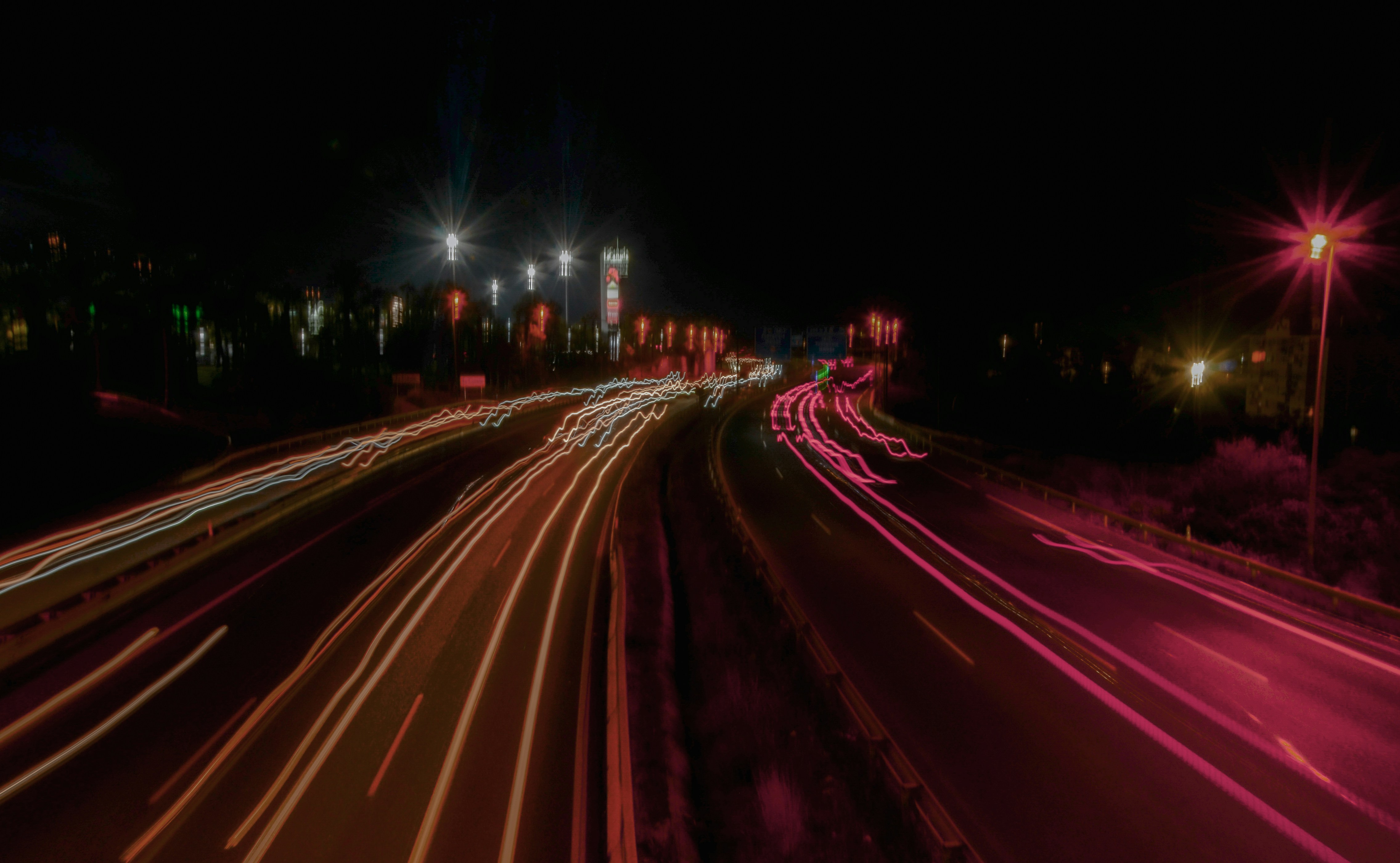 A night time picture of a city street photo – Free Street photography ...