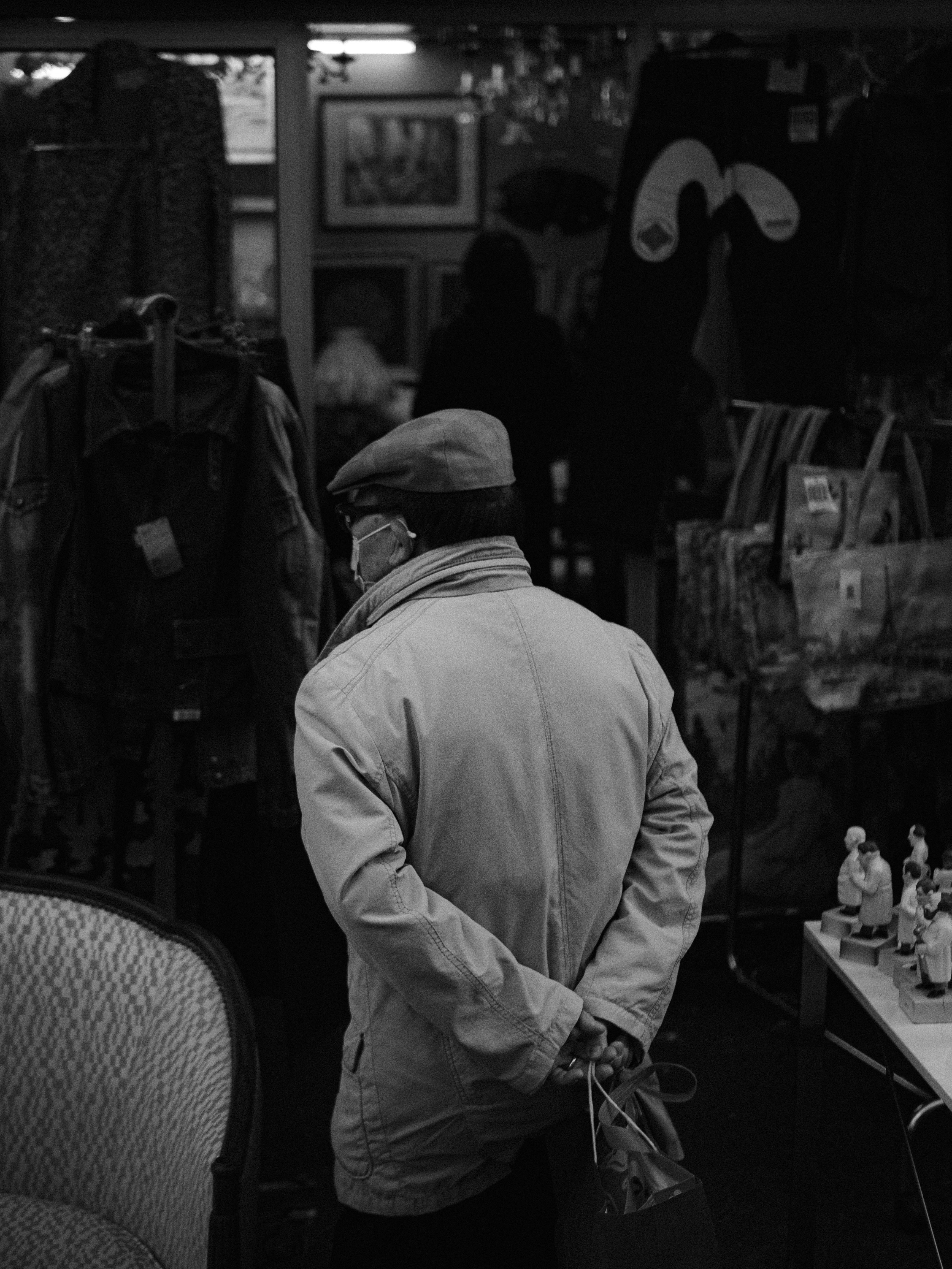 a man standing in front of a mirror in a store