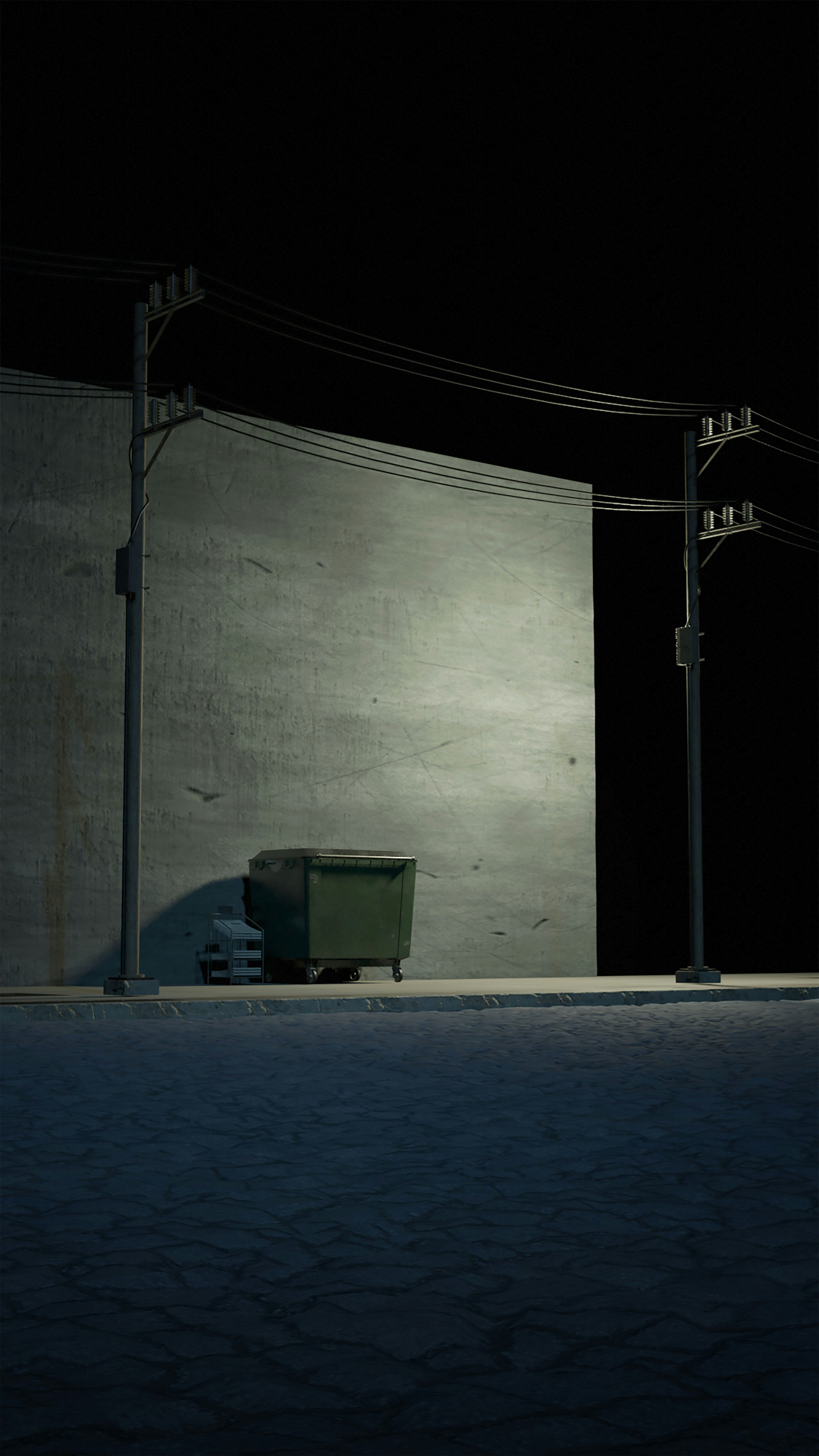A trash can sitting on the side of a road at night photo – Free Render ...