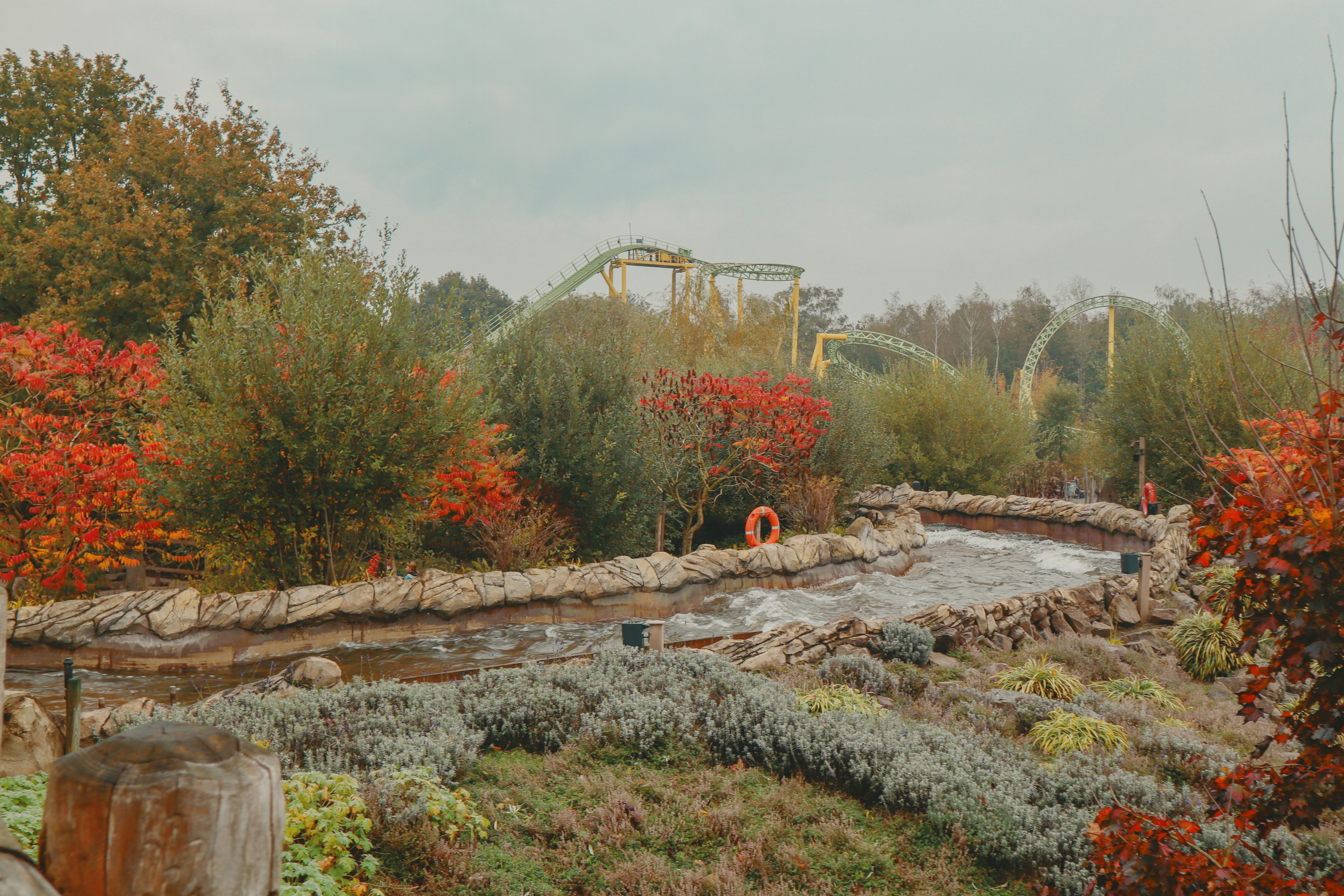 Autumnal Stone Channel Leads the Eye Toward a Distant Roller-Coaster Horizon