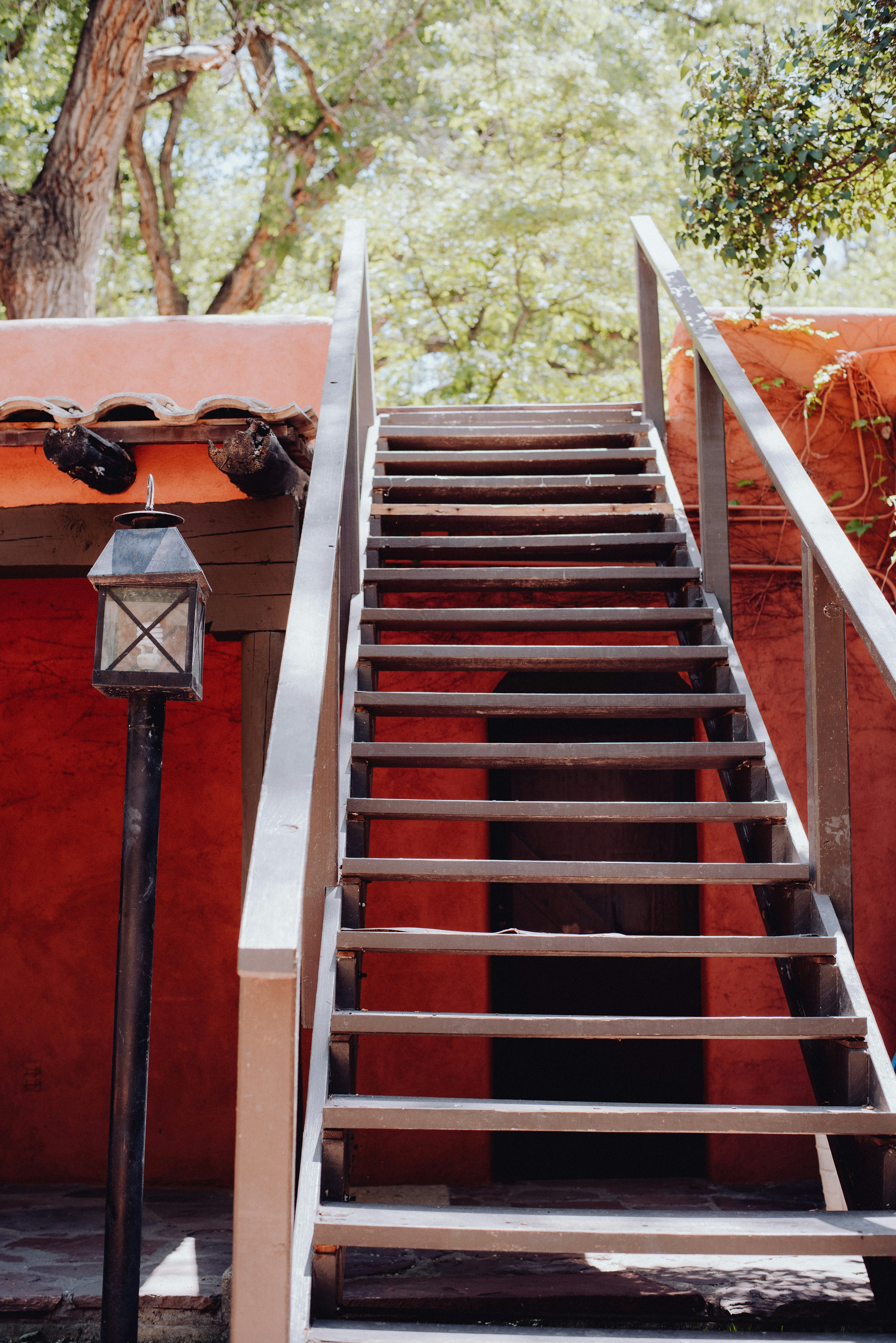 a set of stairs leading up to a red building