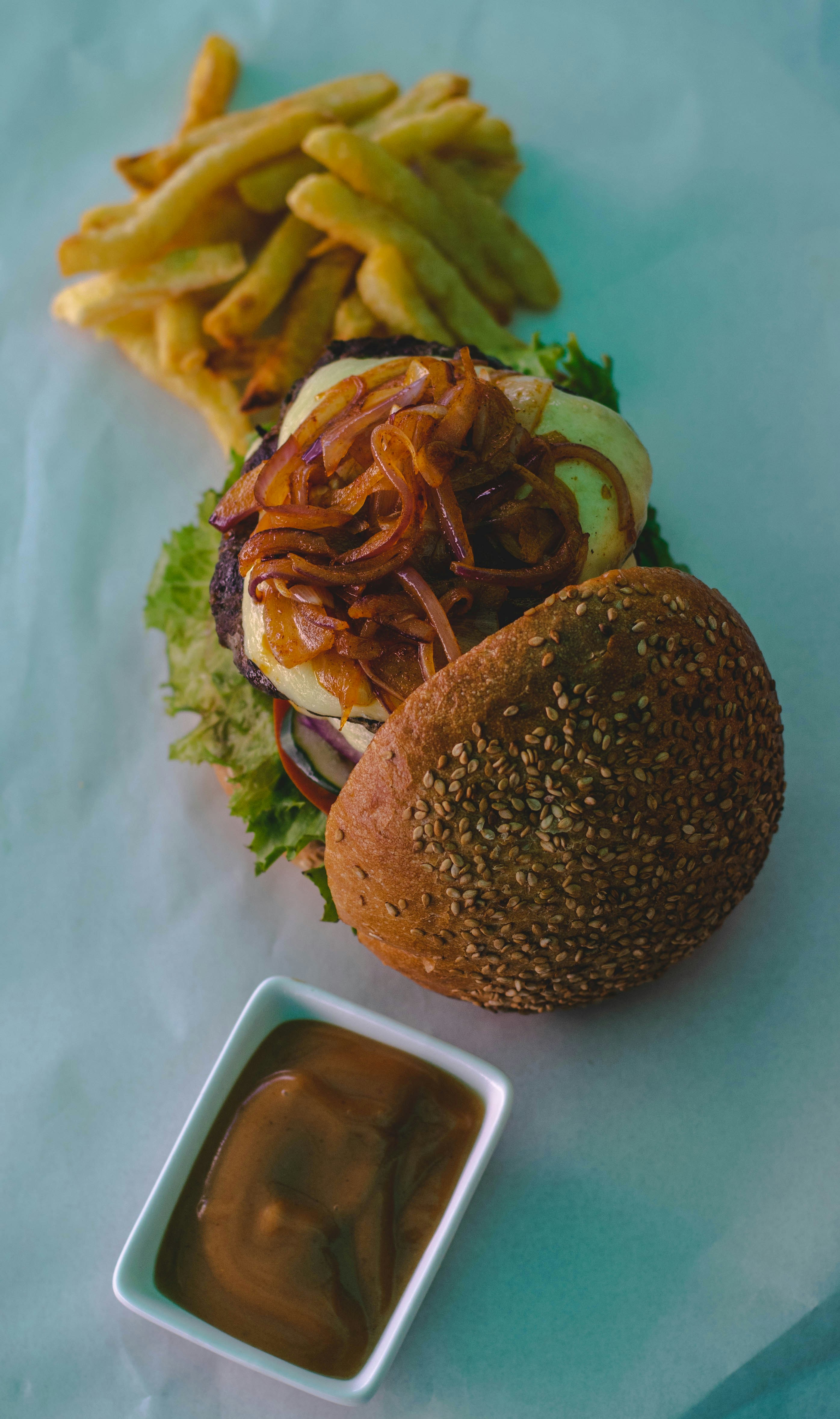 a sandwich and some french fries on a table