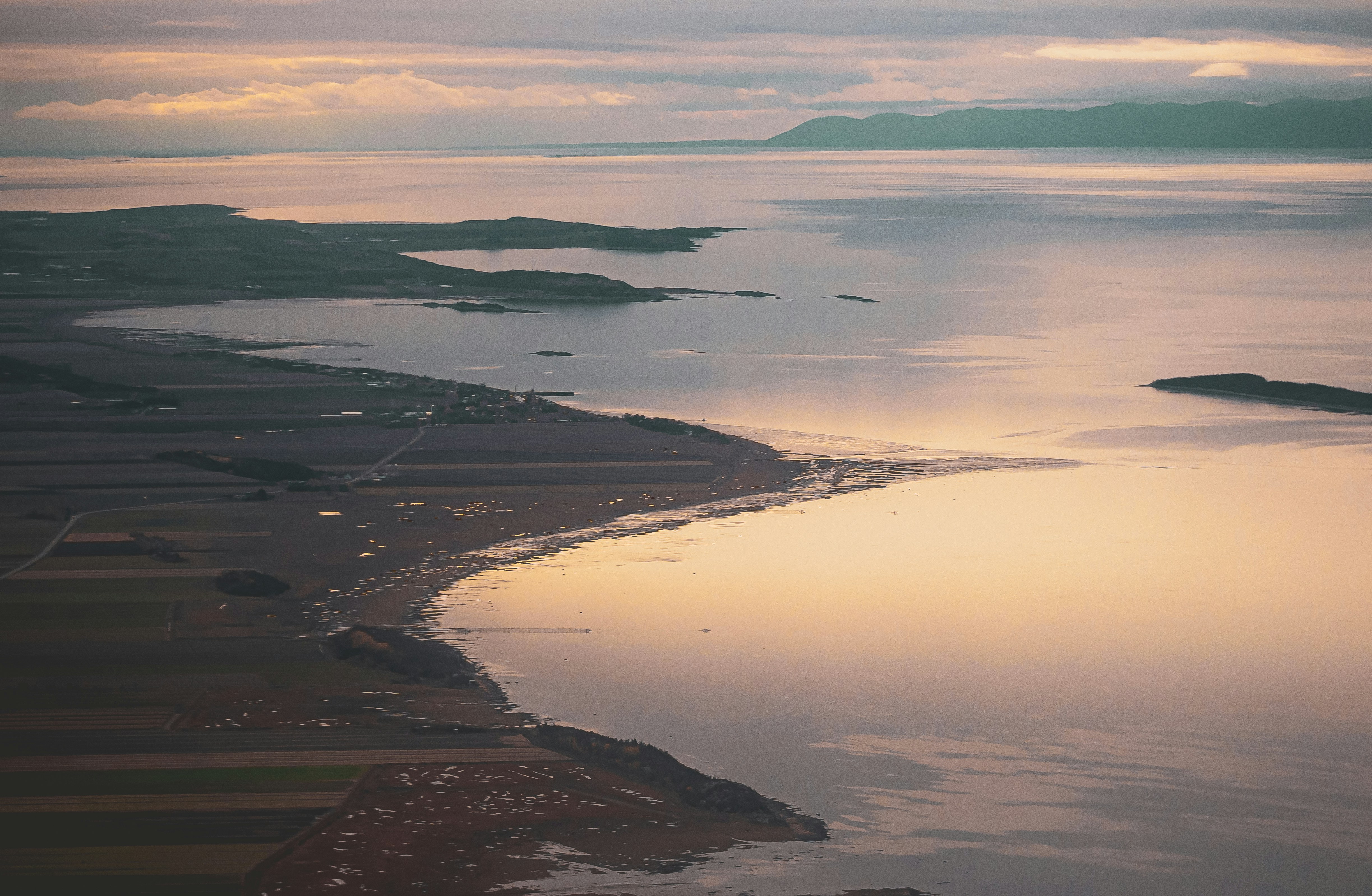 A body of water with land in the background photo – Free Nature Image ...