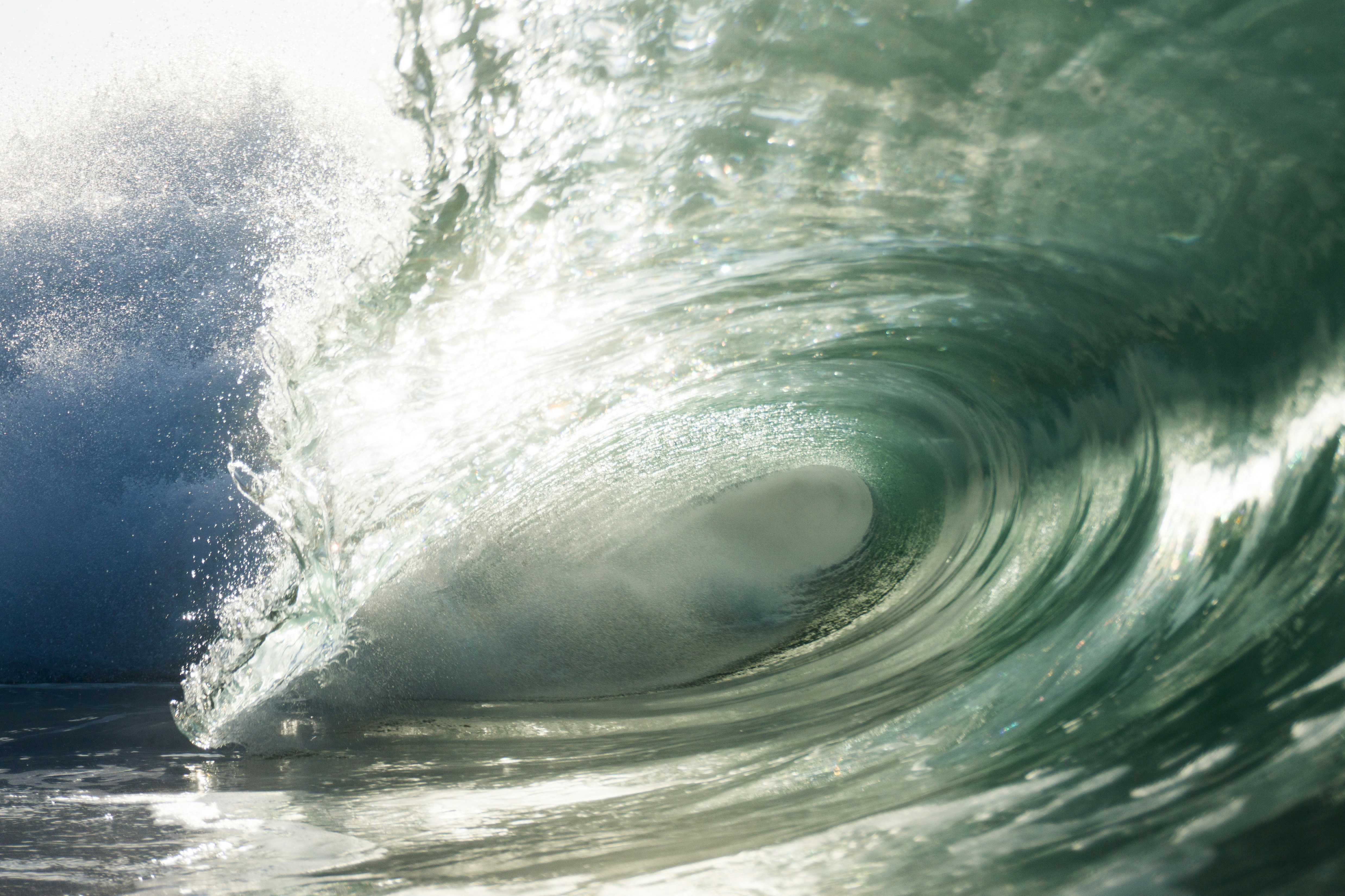 A large wave is coming towards the shore photo – Free Grey Image on ...