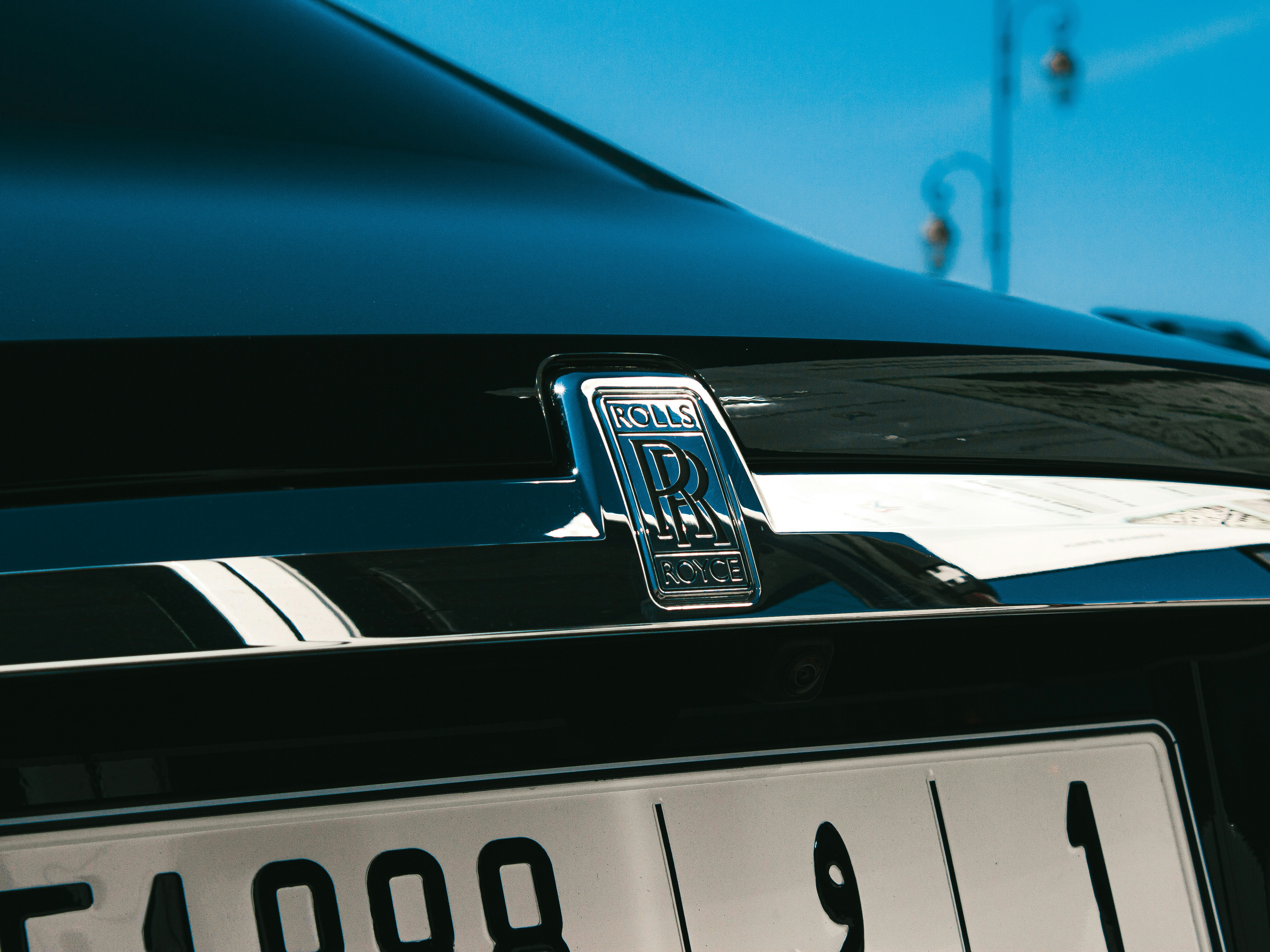 A close up of a car with a license plate photo – Free Rolls royce Image ...