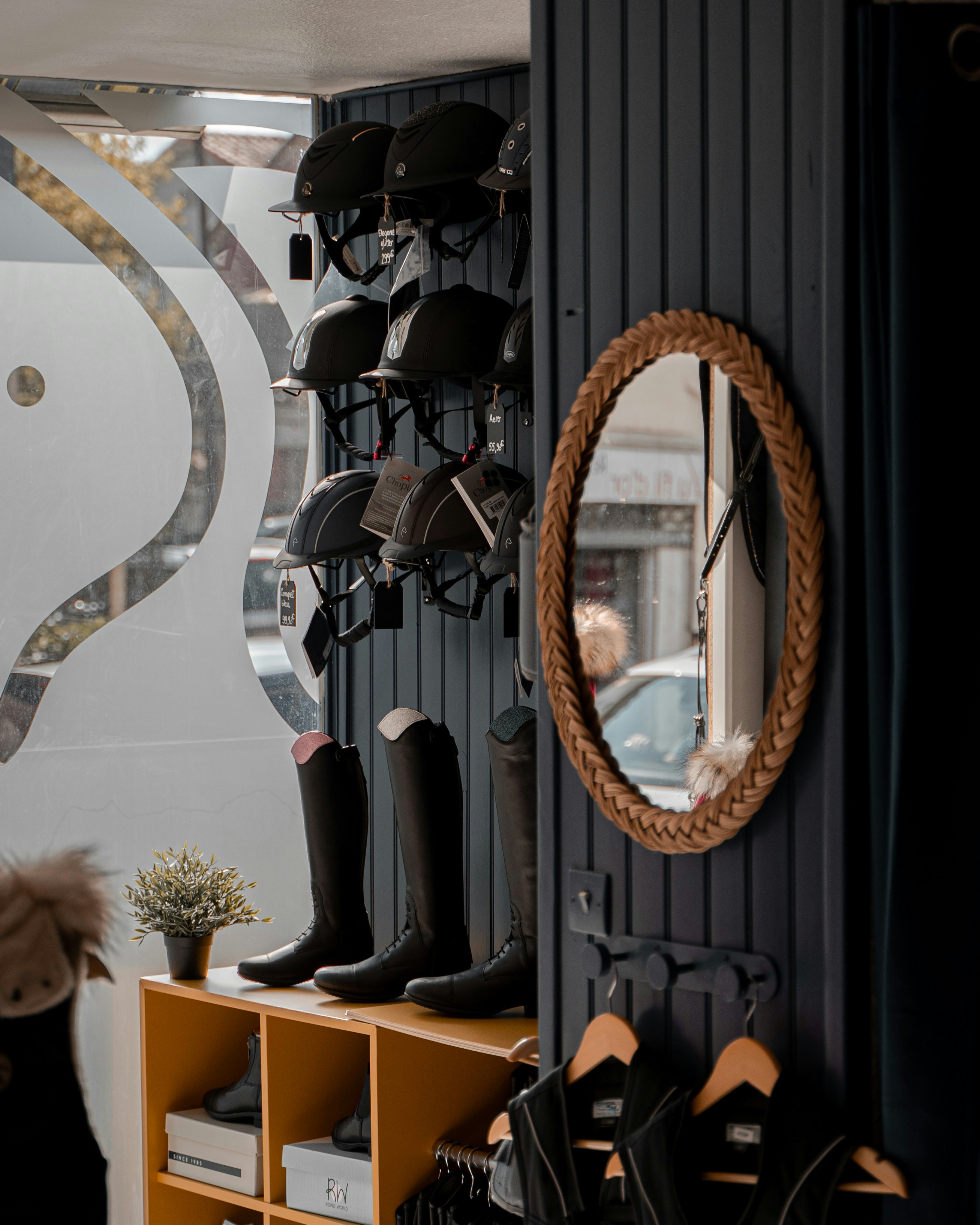 Boots, Hats, and a Woven Mirror: A Quiet Boutique Display