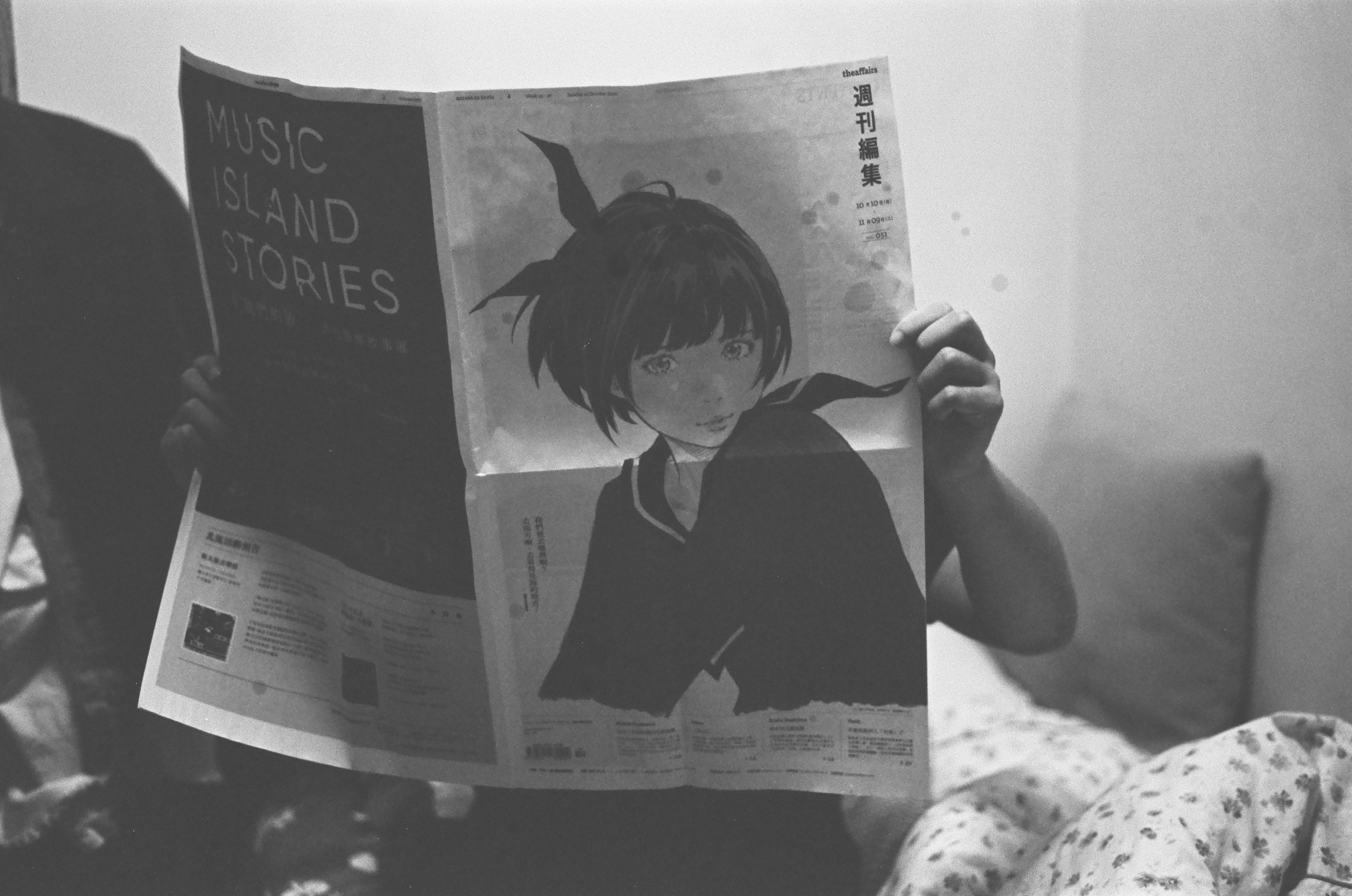 A person sitting on a bed reading a book photo – Free Human Image on ...