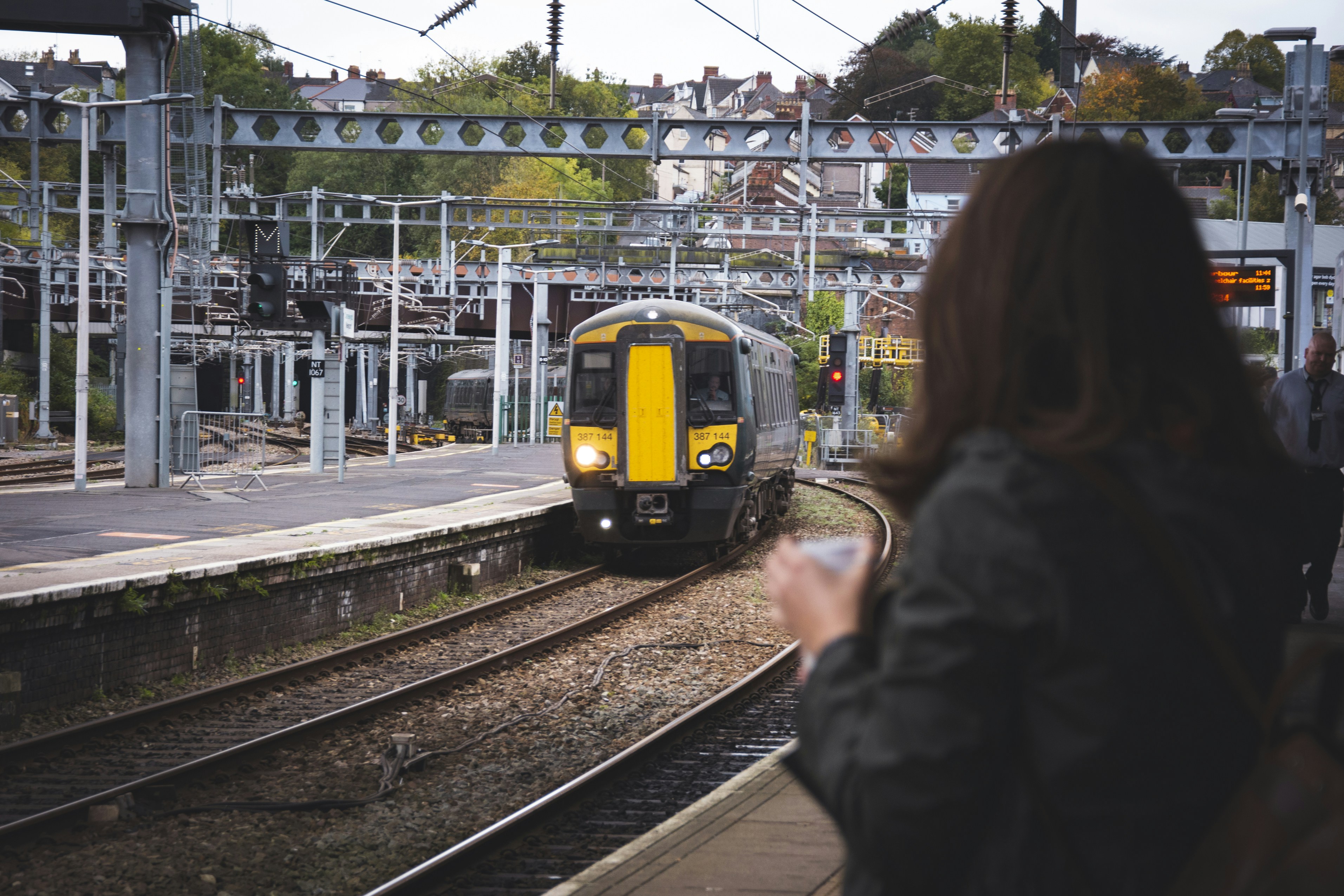 Approaching Ember: Yellow-fronted Train Nears a Quiet Platform