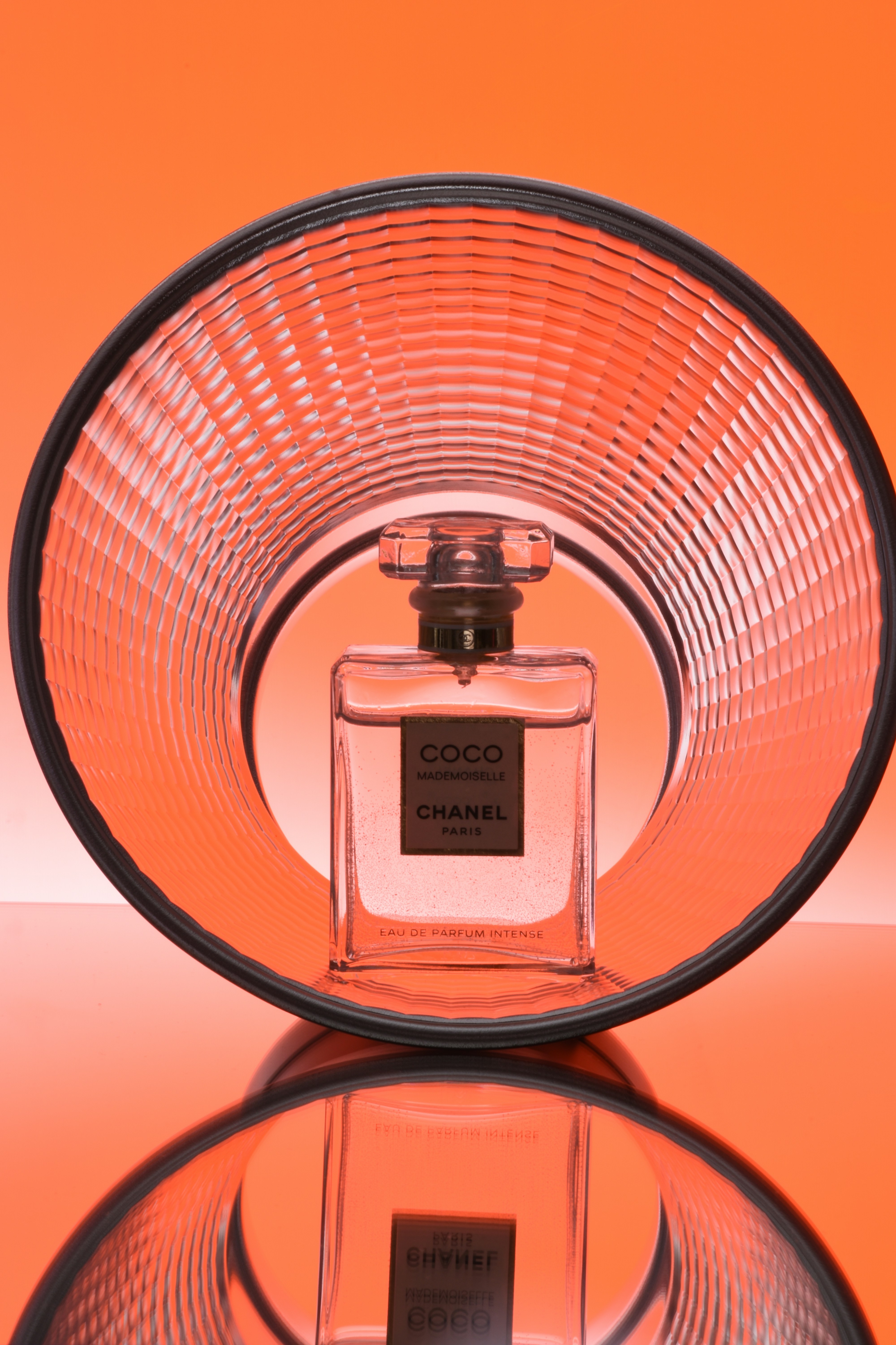 Chanel Coco in Circular Glow: a perfume shot framed by a ring light