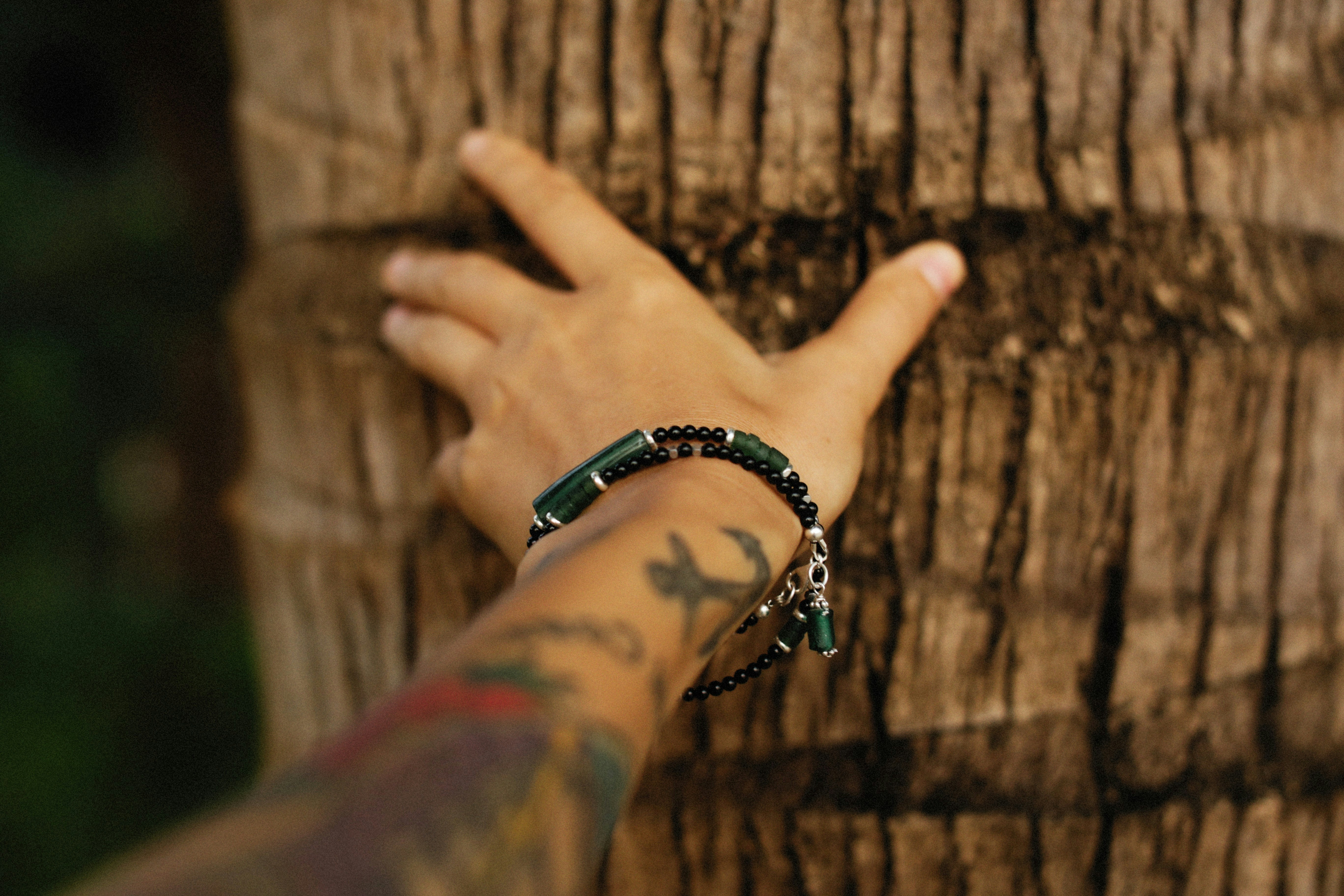 a person's arm and arm with a bracelet on it