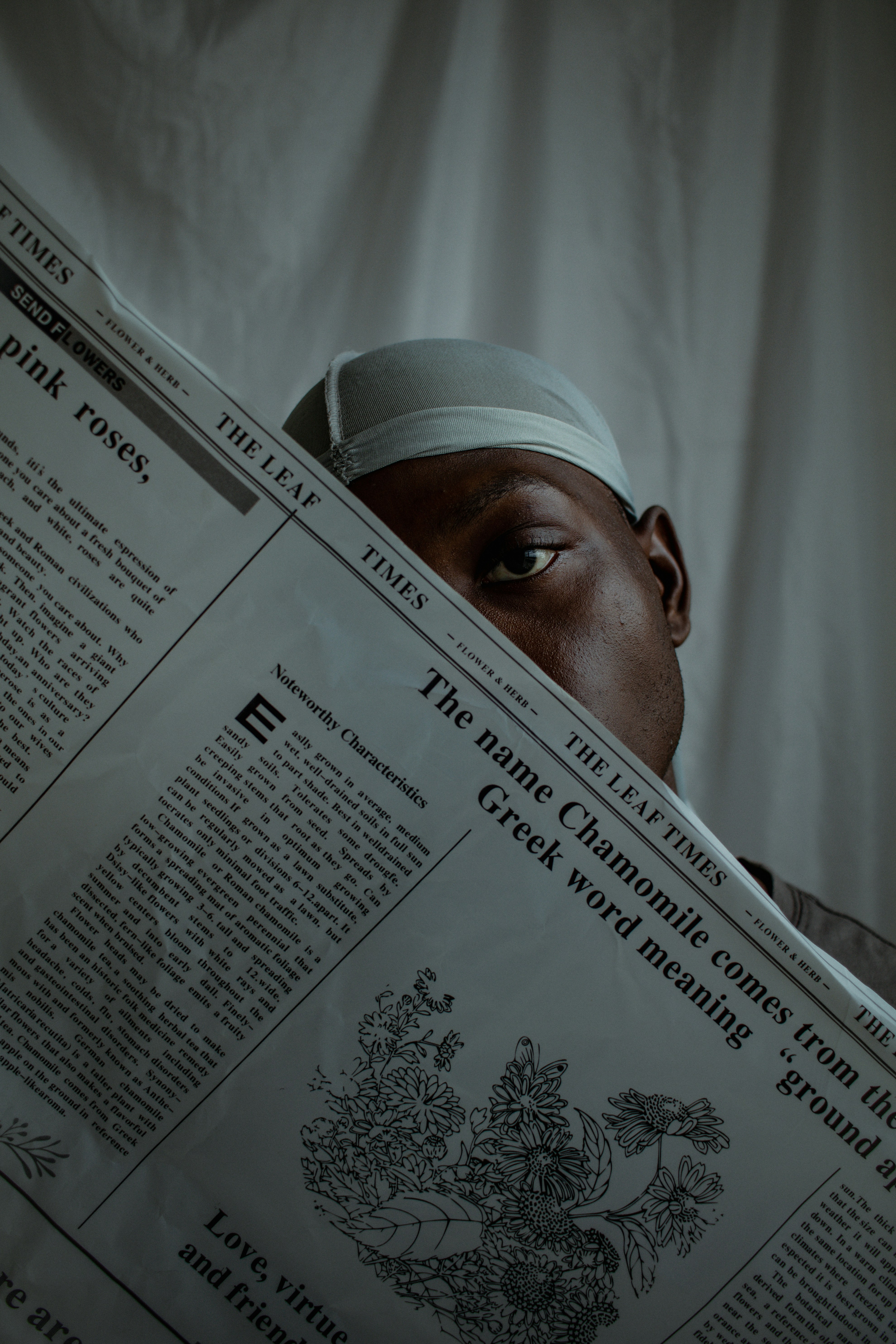 Hidden gaze behind a folded front page