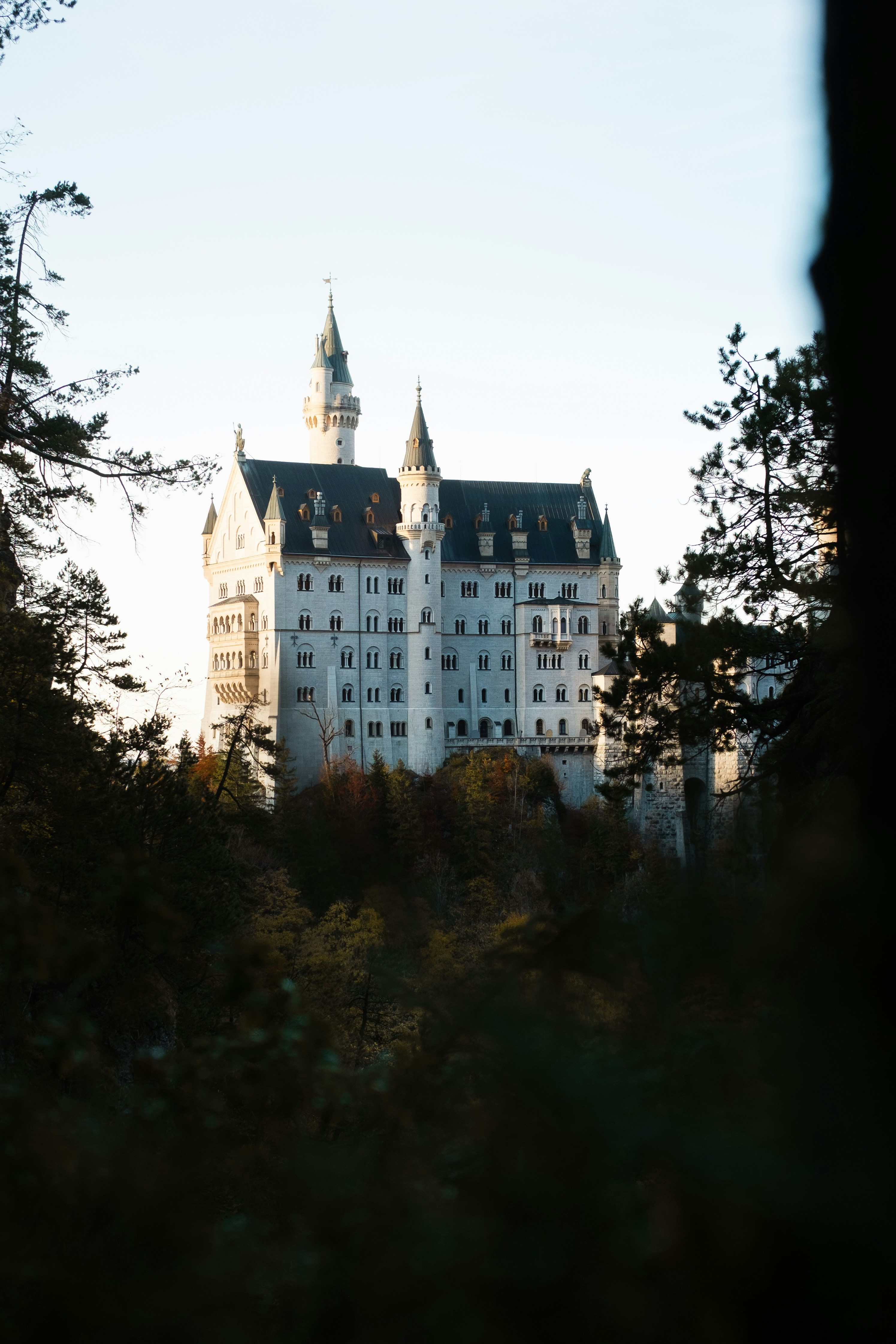 A large white castle with a clock tower photo – Free Deutschland Image ...