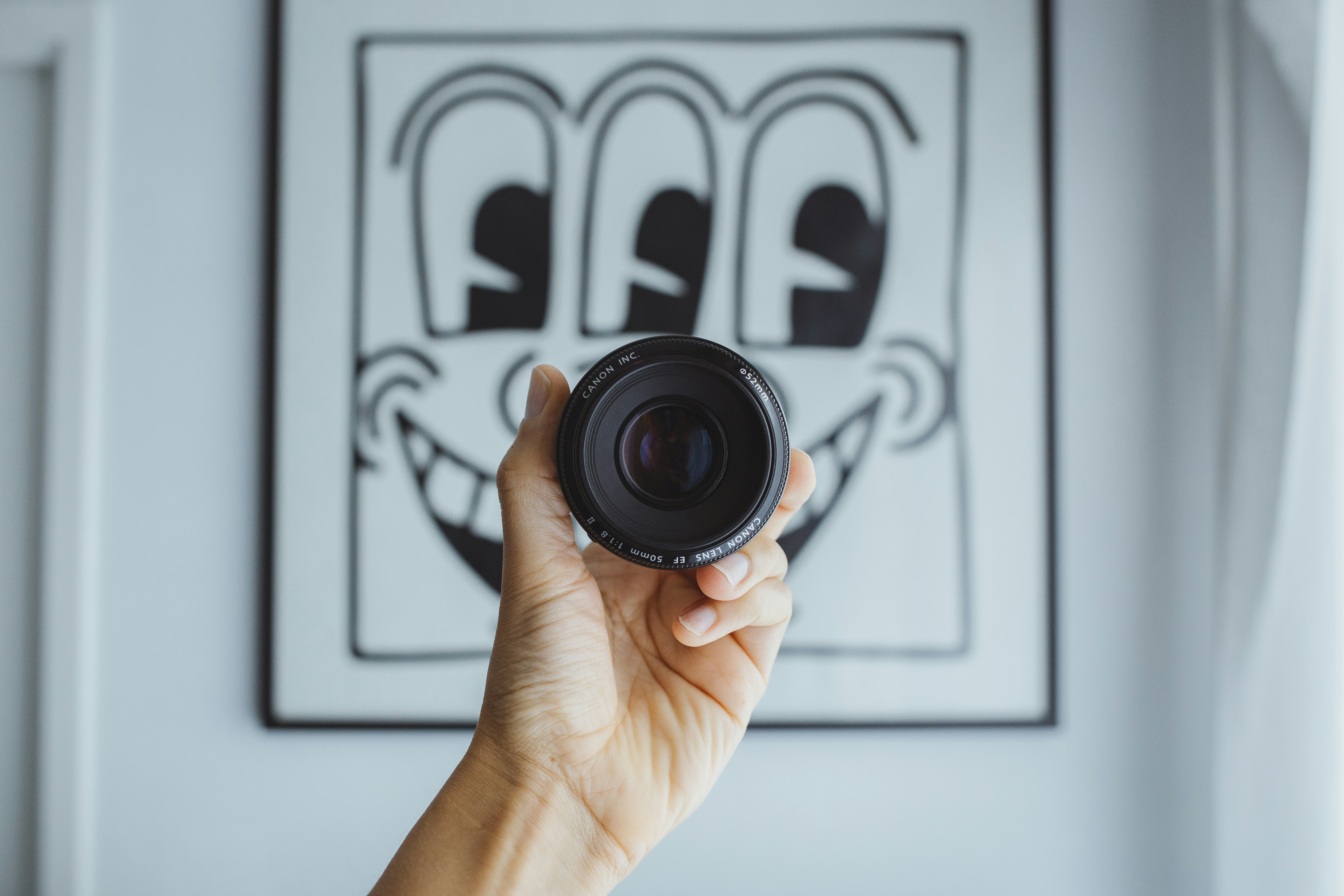 Lens in Hand, Grinning Frame: A Study in Framing