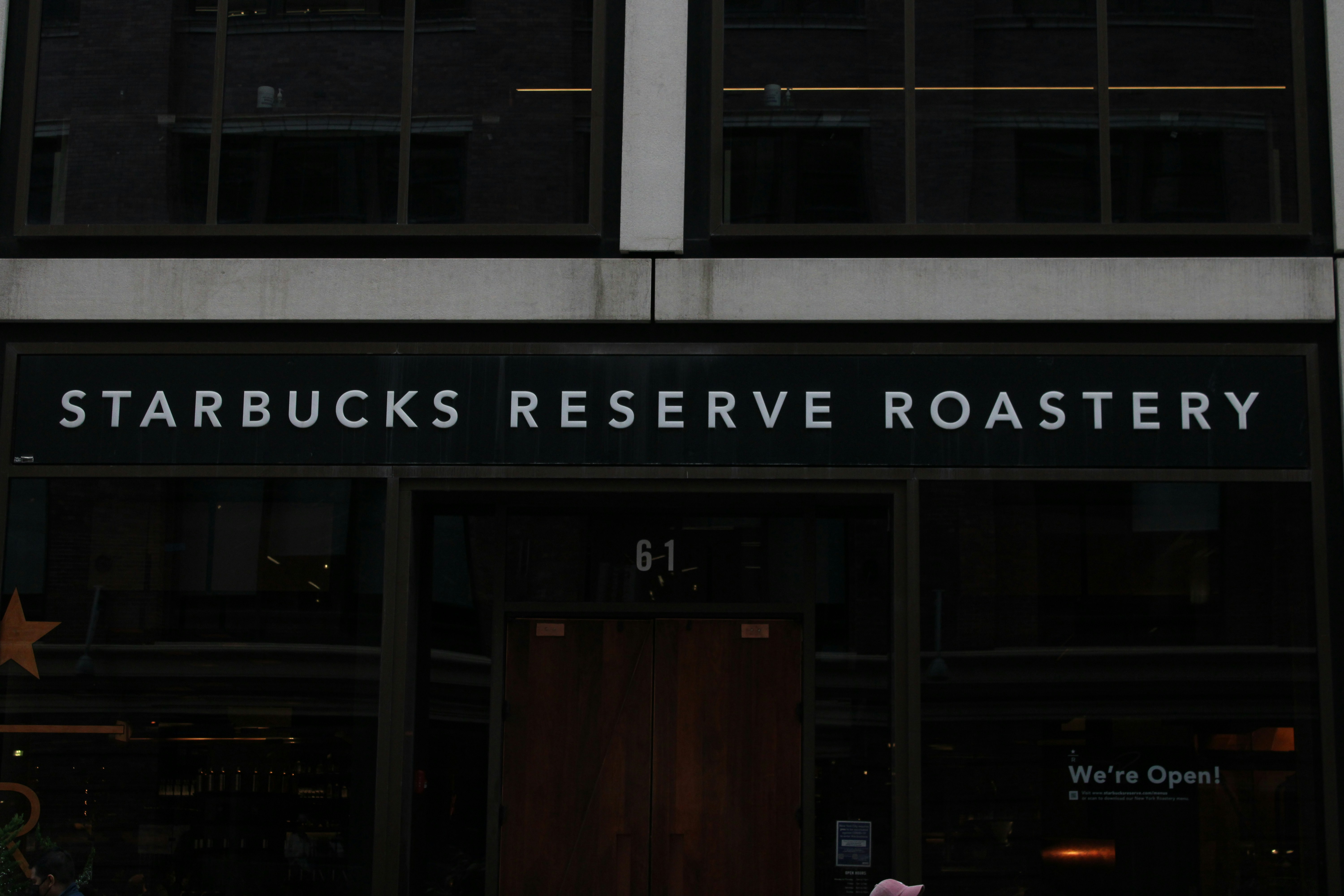 A store front with a sign that reads starbucks reserve roastery photo ...