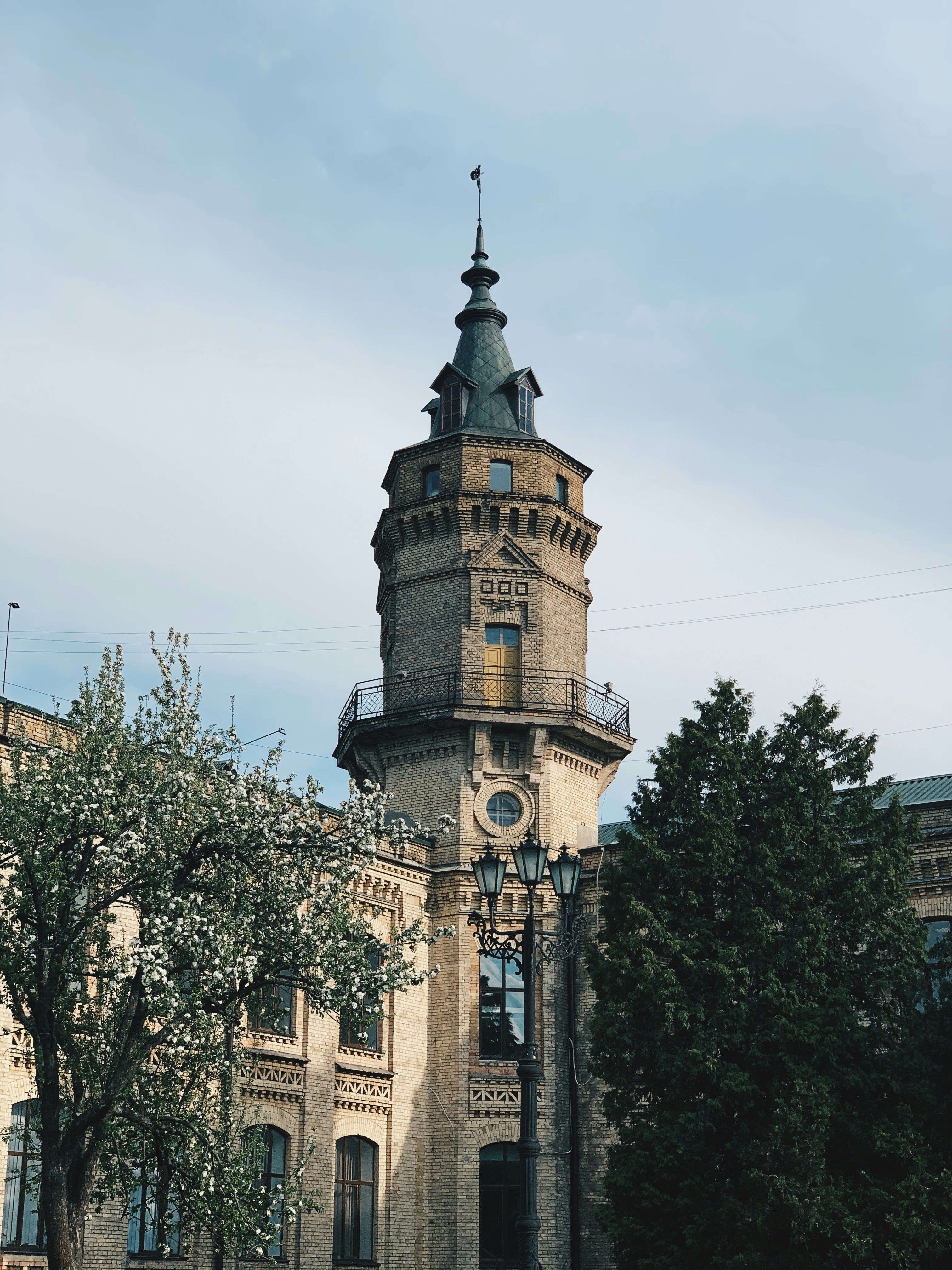A tall tower with a clock on the top of it photo – Free Kyiv Image on ...