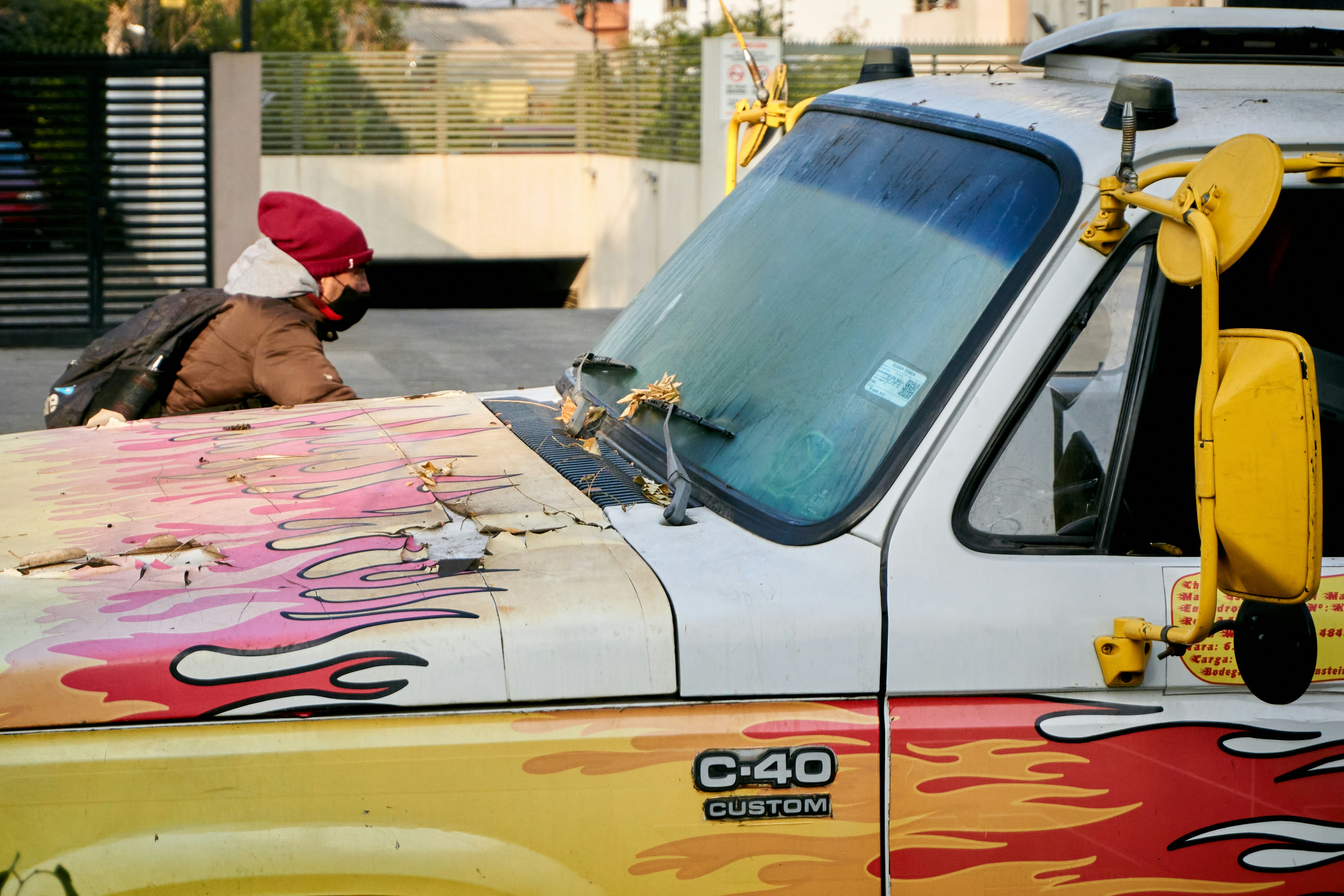 Dusty Road Patrol: A Weathered Van and a Curious Window