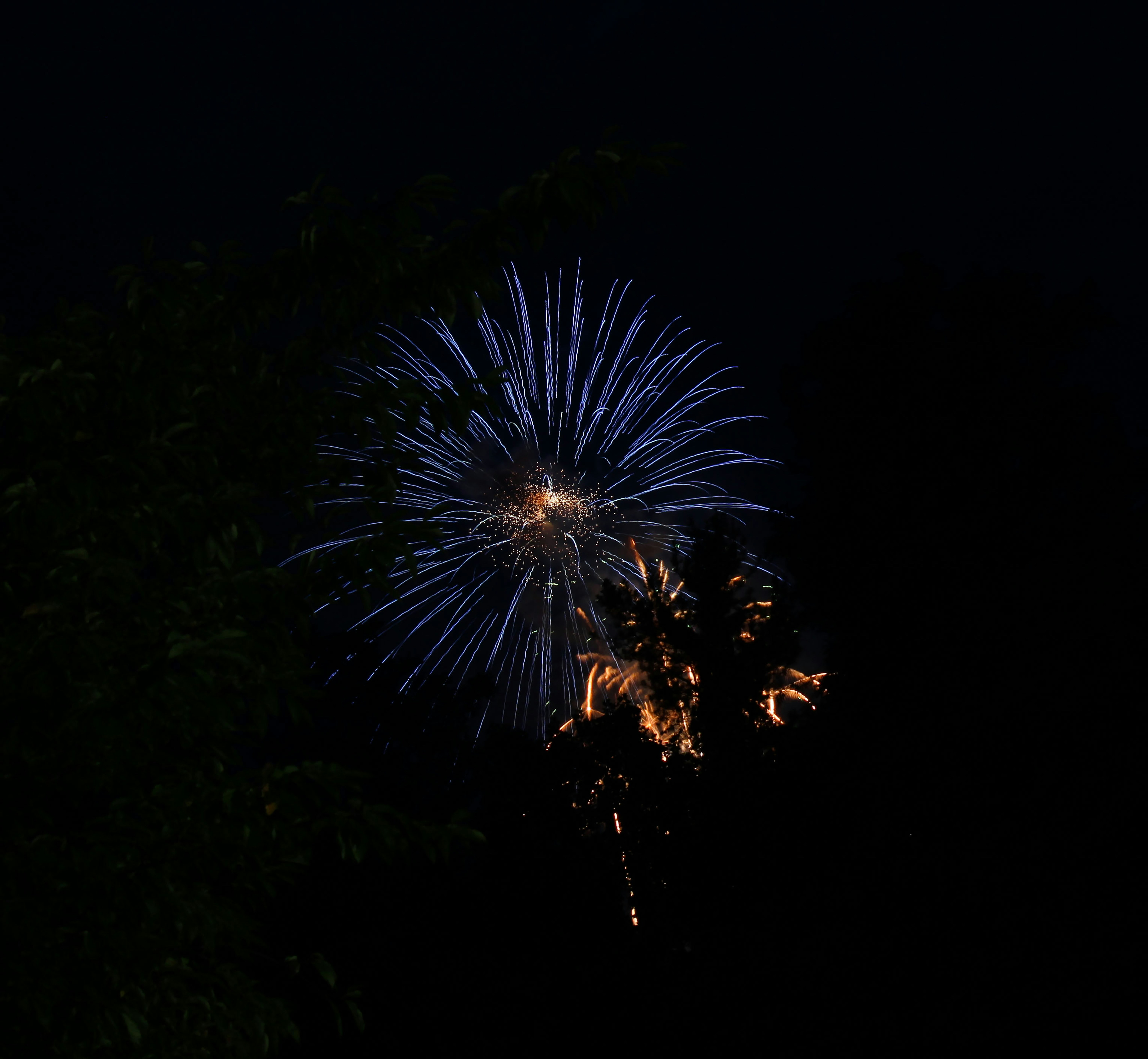 A large fireworks is lit up in the night sky photo – Free Fireworks ...