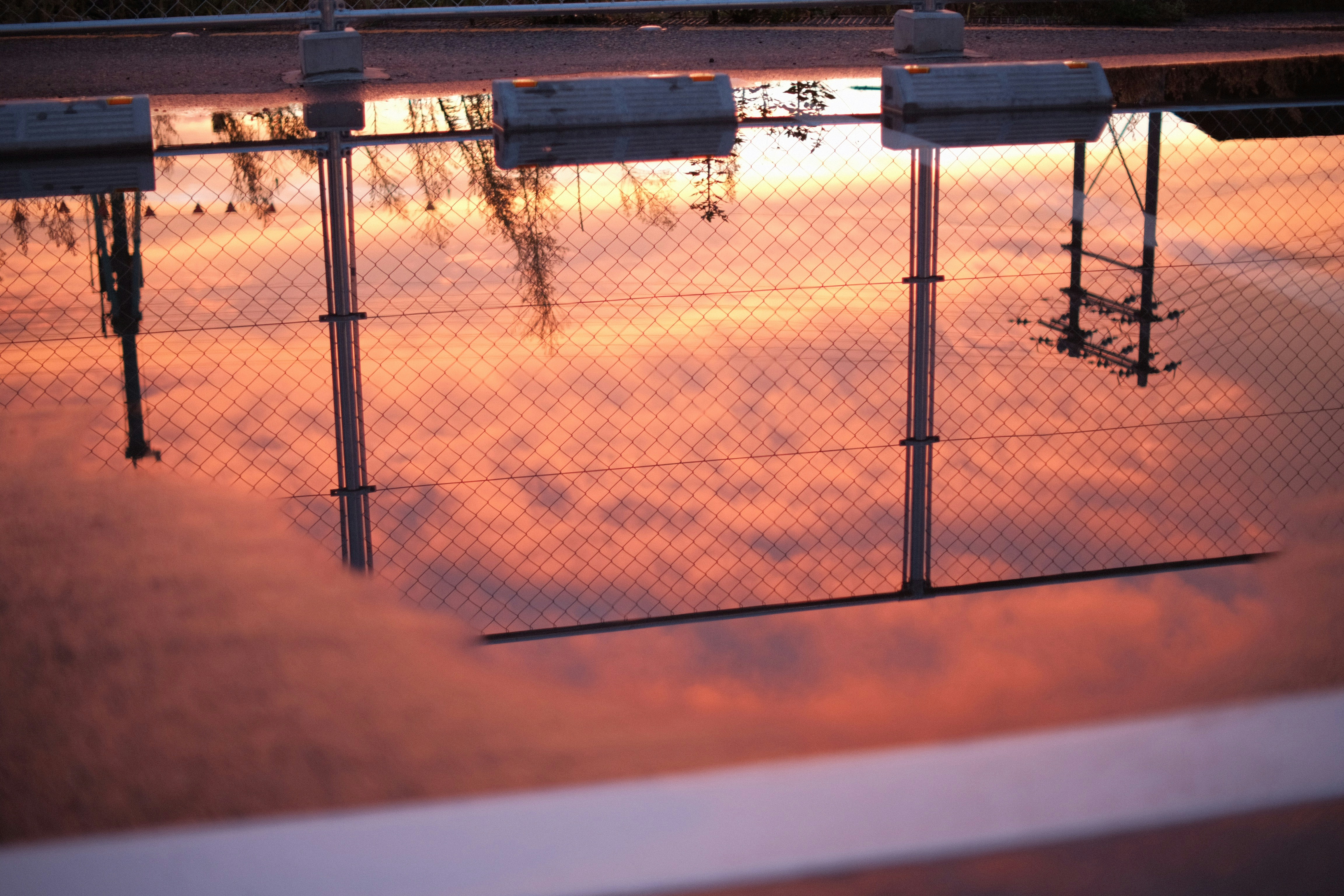 a reflection of the sky in a pool of water