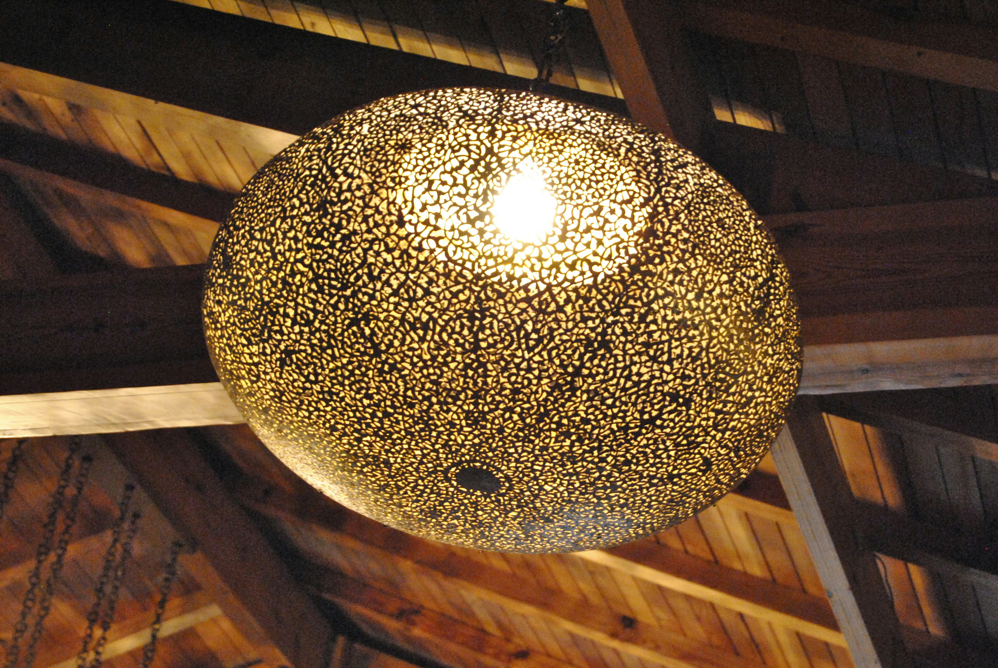 a light hanging from the ceiling of a building