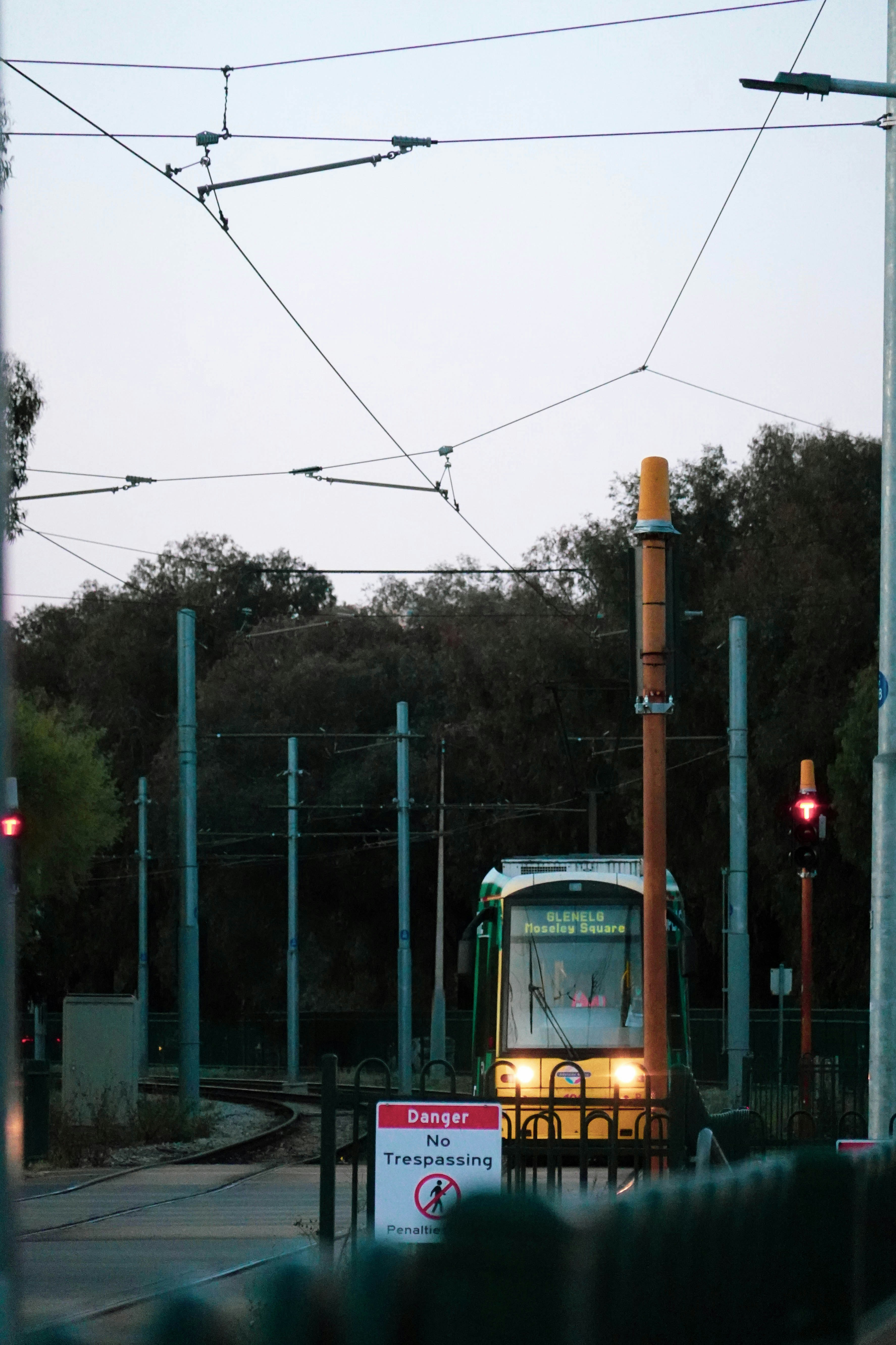 a bus driving down a street next to power lines