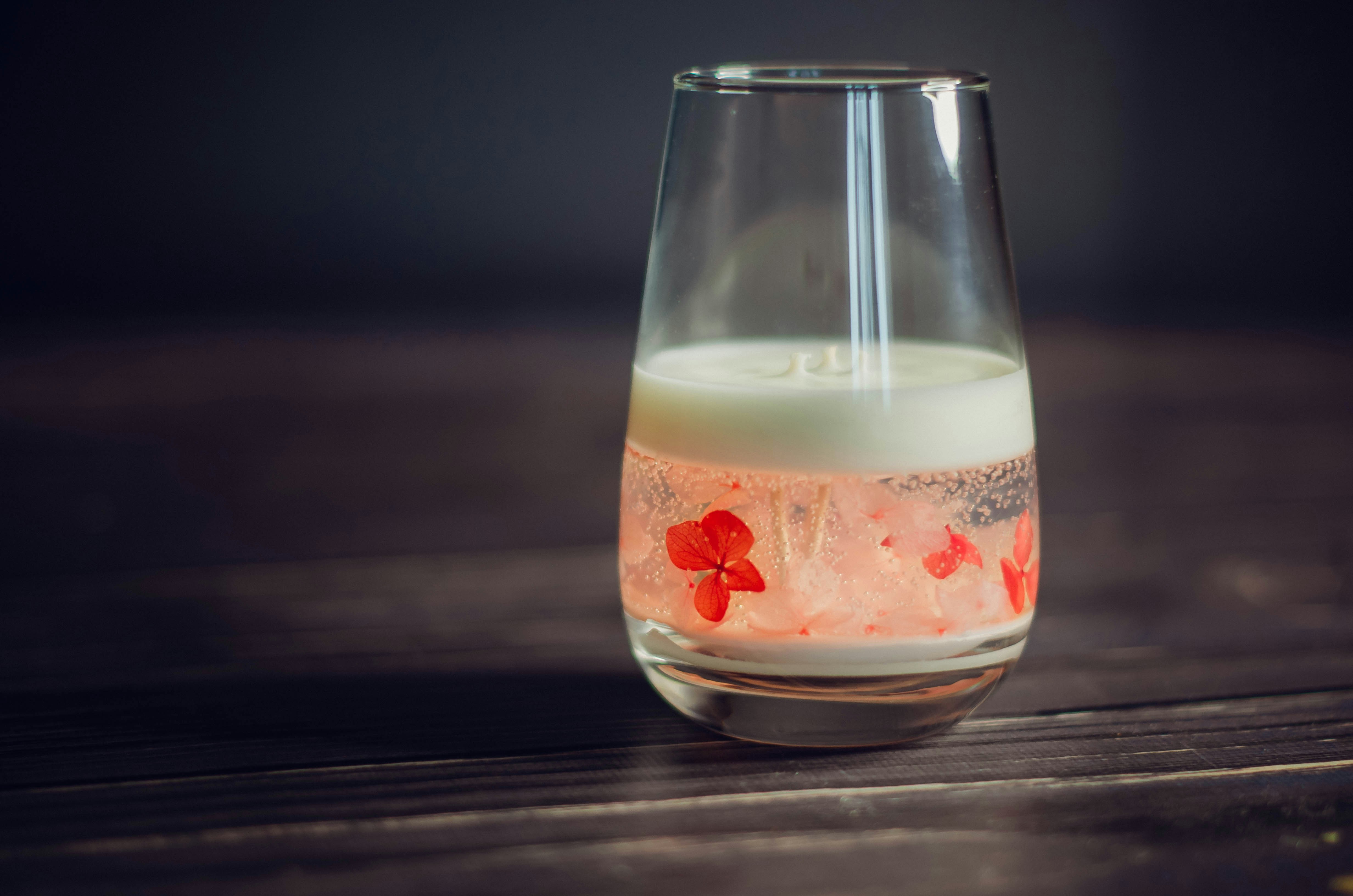 Glass of Quiet Bubbles: A Gentle Moment with Rose Petals