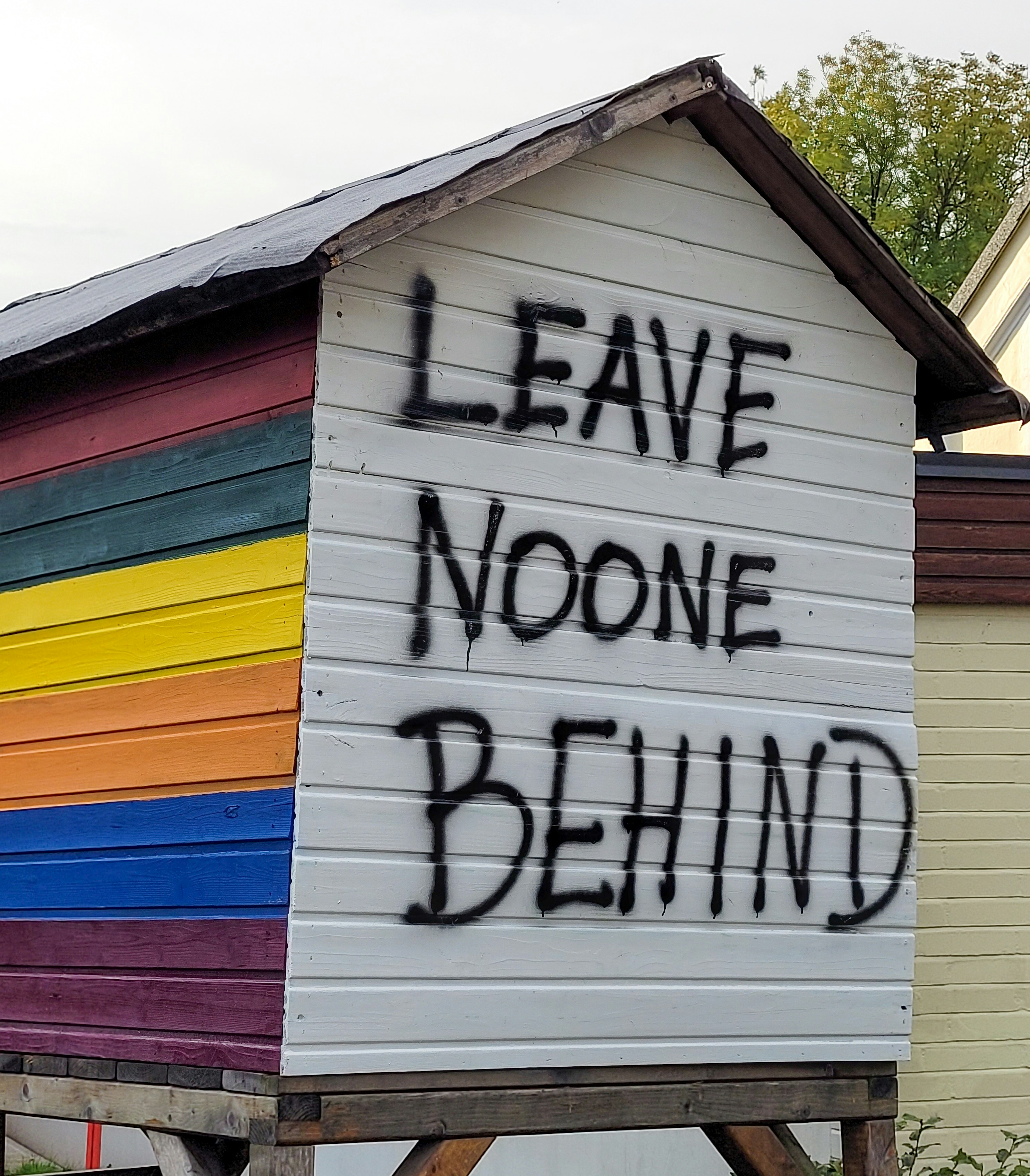 A sign that says leave no one behind photo – Free Graffiti Image on ...