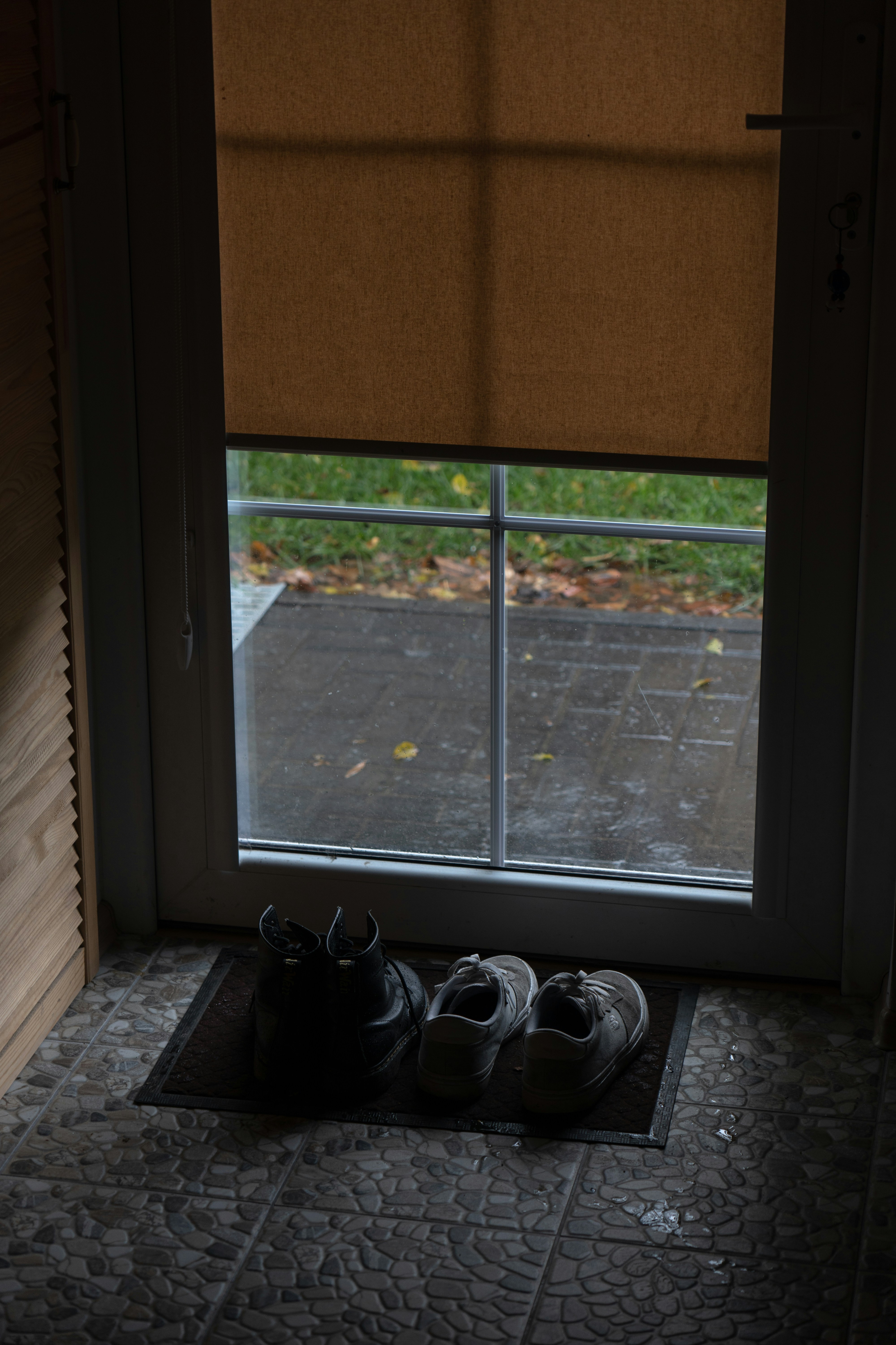 Footwear at the Threshold: Rain-Gloss and Quiet Light