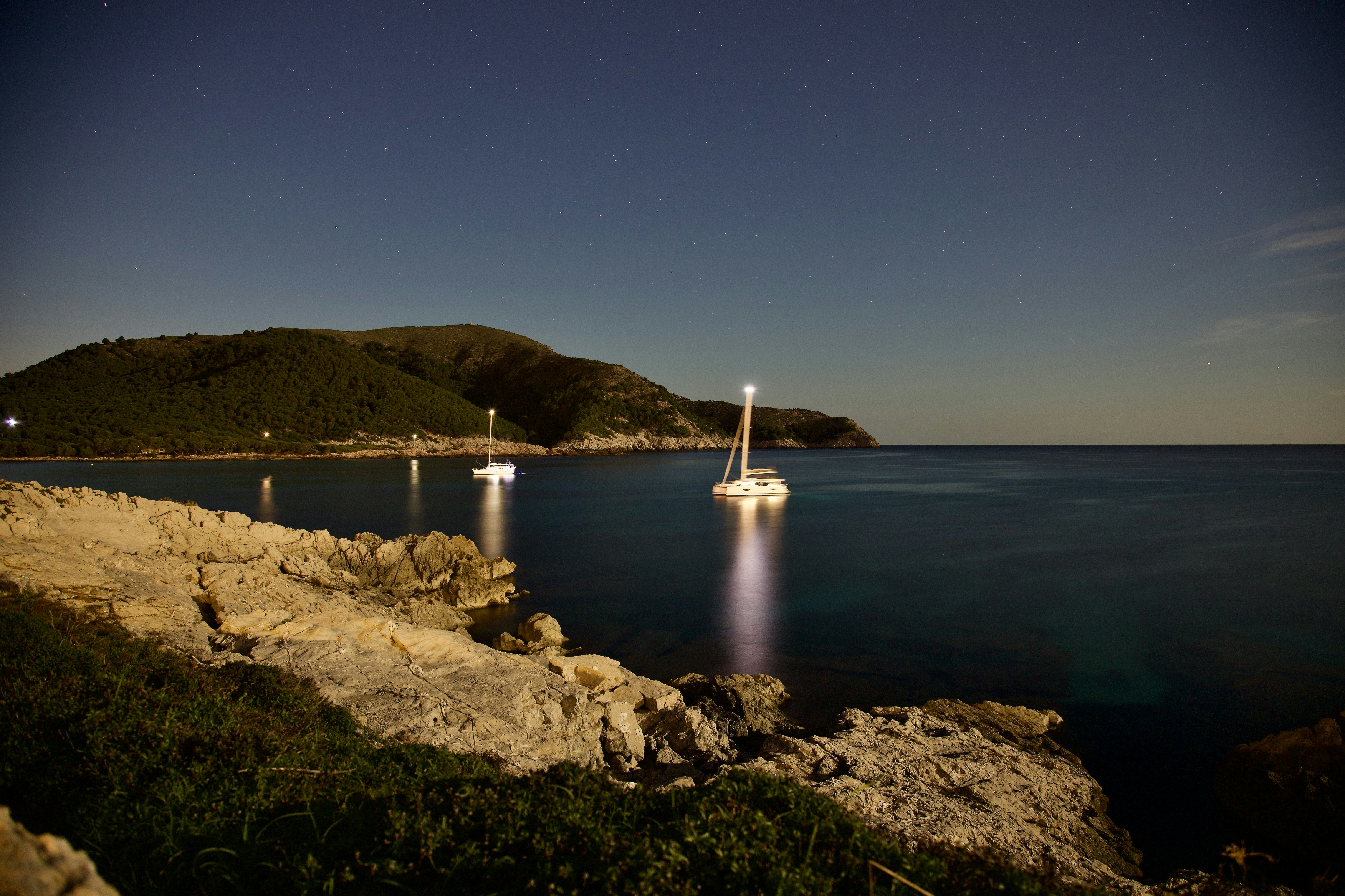 Moonlit Sails Over a Quiet Cove