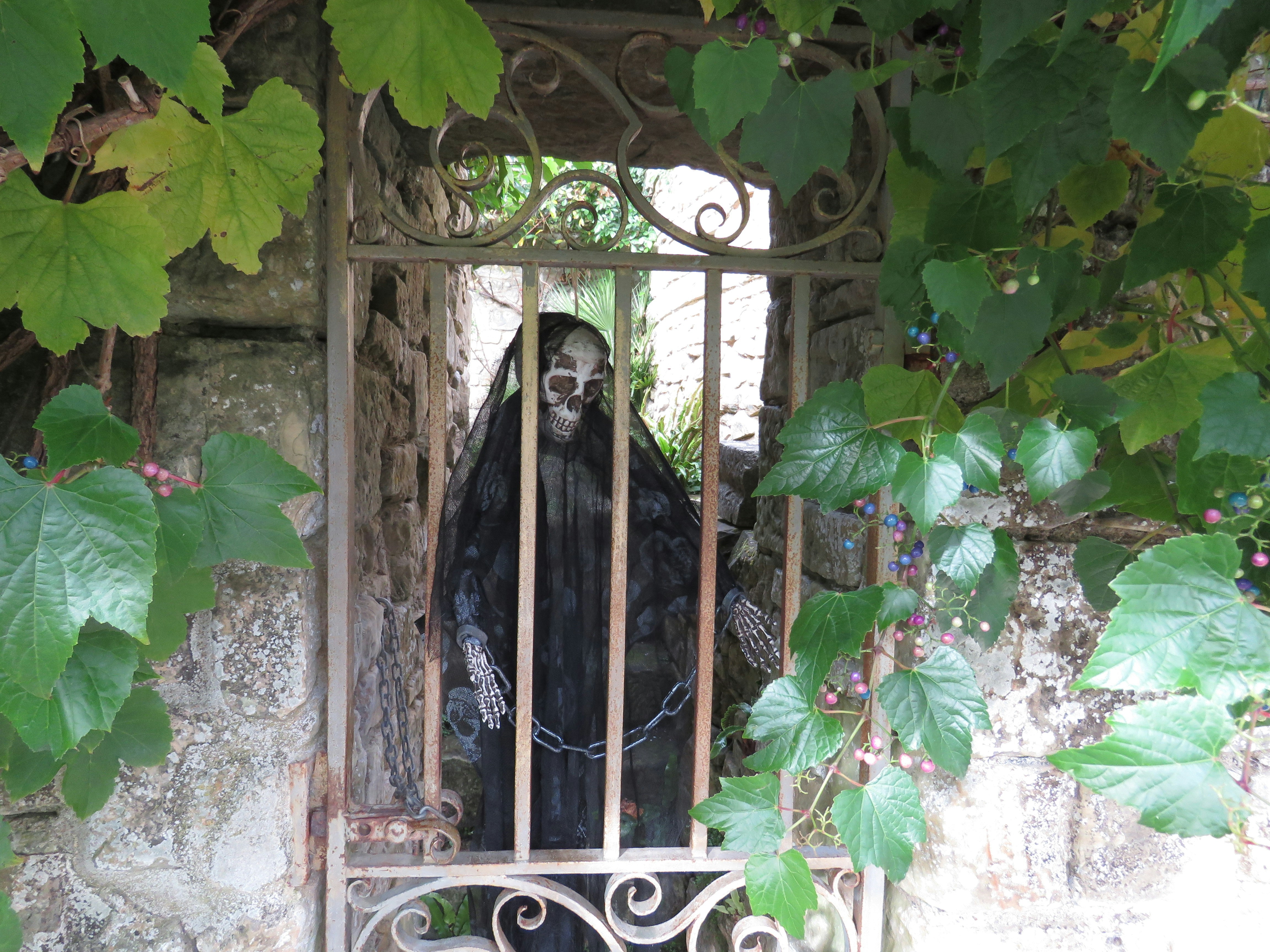 A statue of a skeleton in a jail cell photo – Free Hever castle kent ...