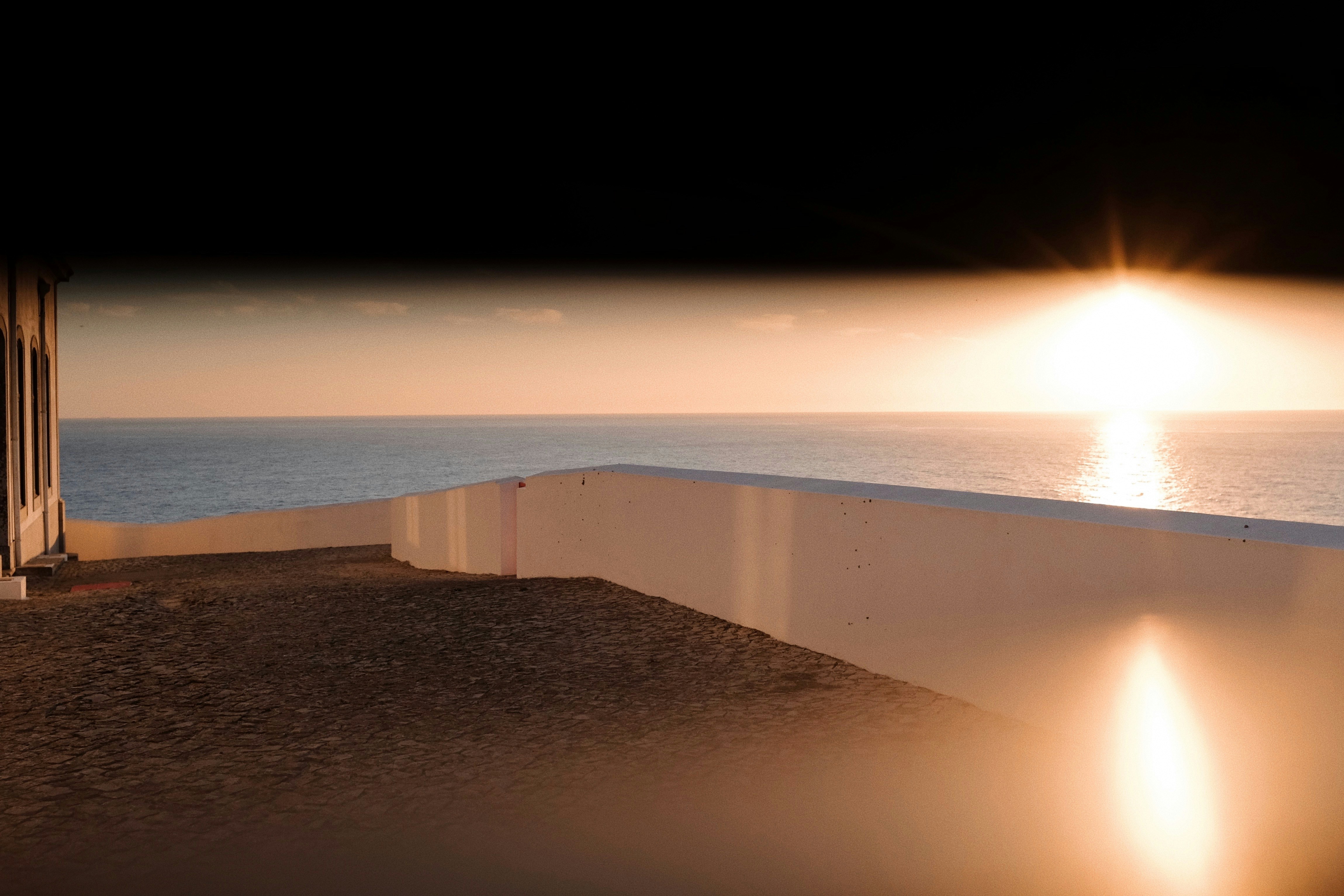 Horizon's Warm Embrace from a Seaside Terrace