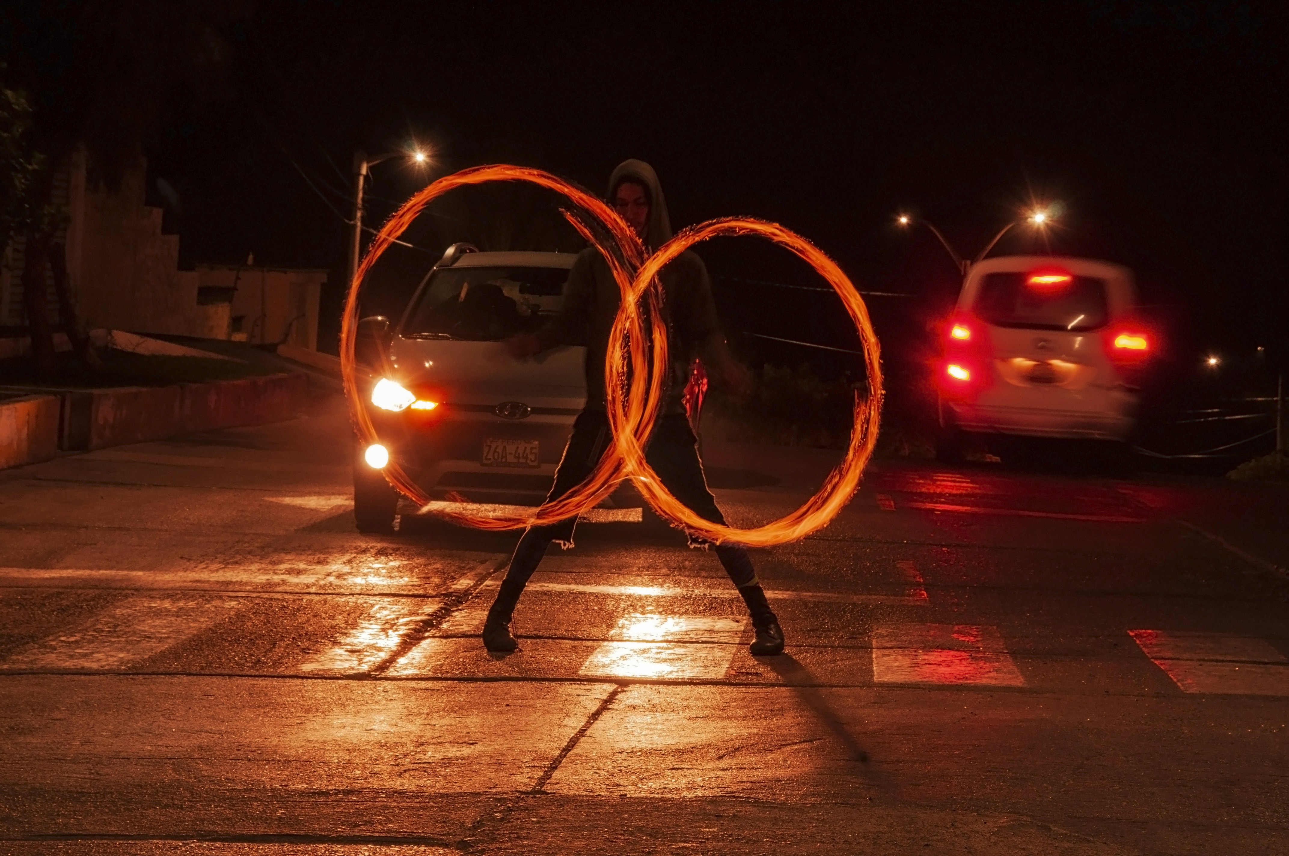 Fiery Dance: Torches Conjure Infinity Loops on Night Street