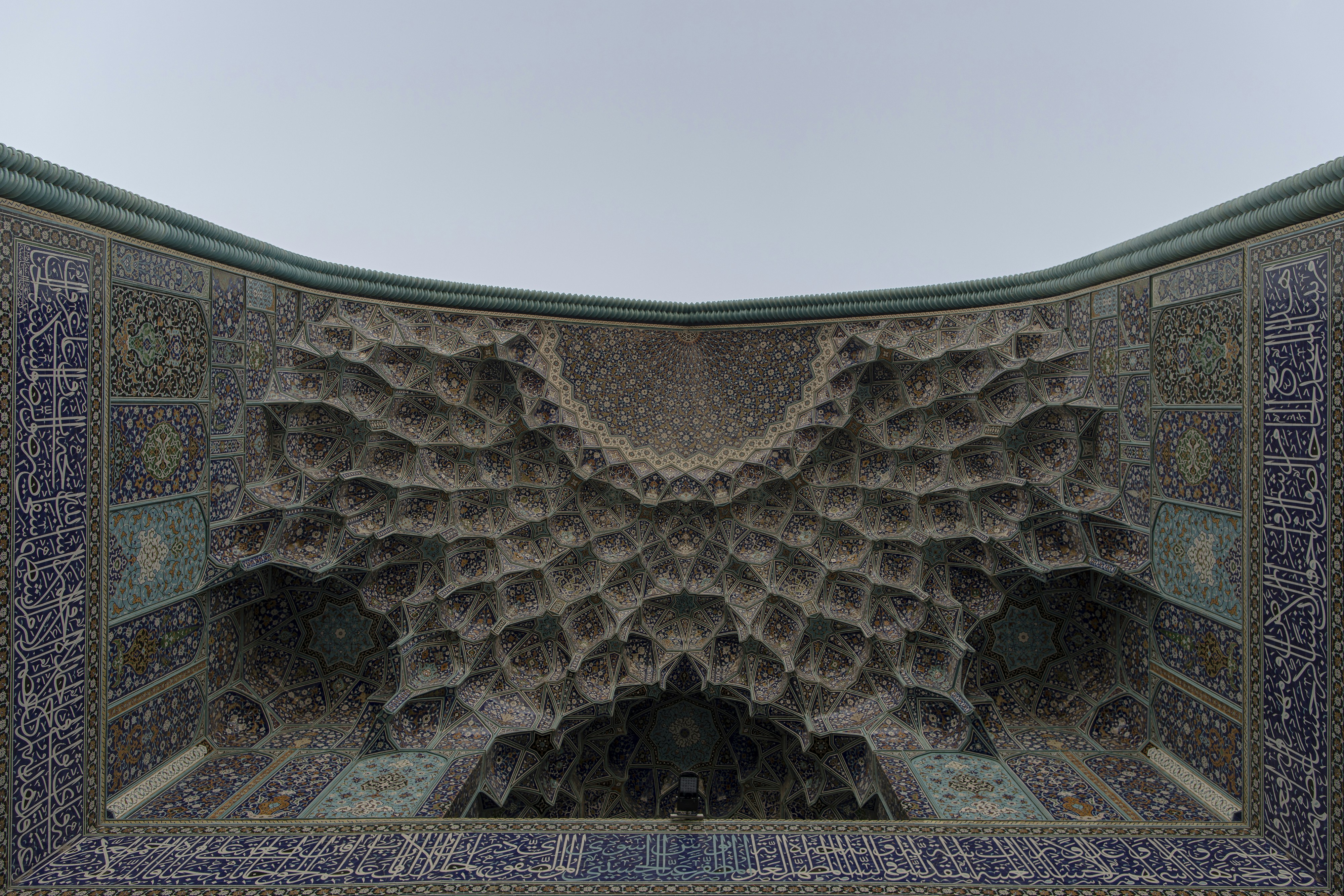 Detailed muqarnas vault showcasing complex geometric patterns in traditional Persian architecture.