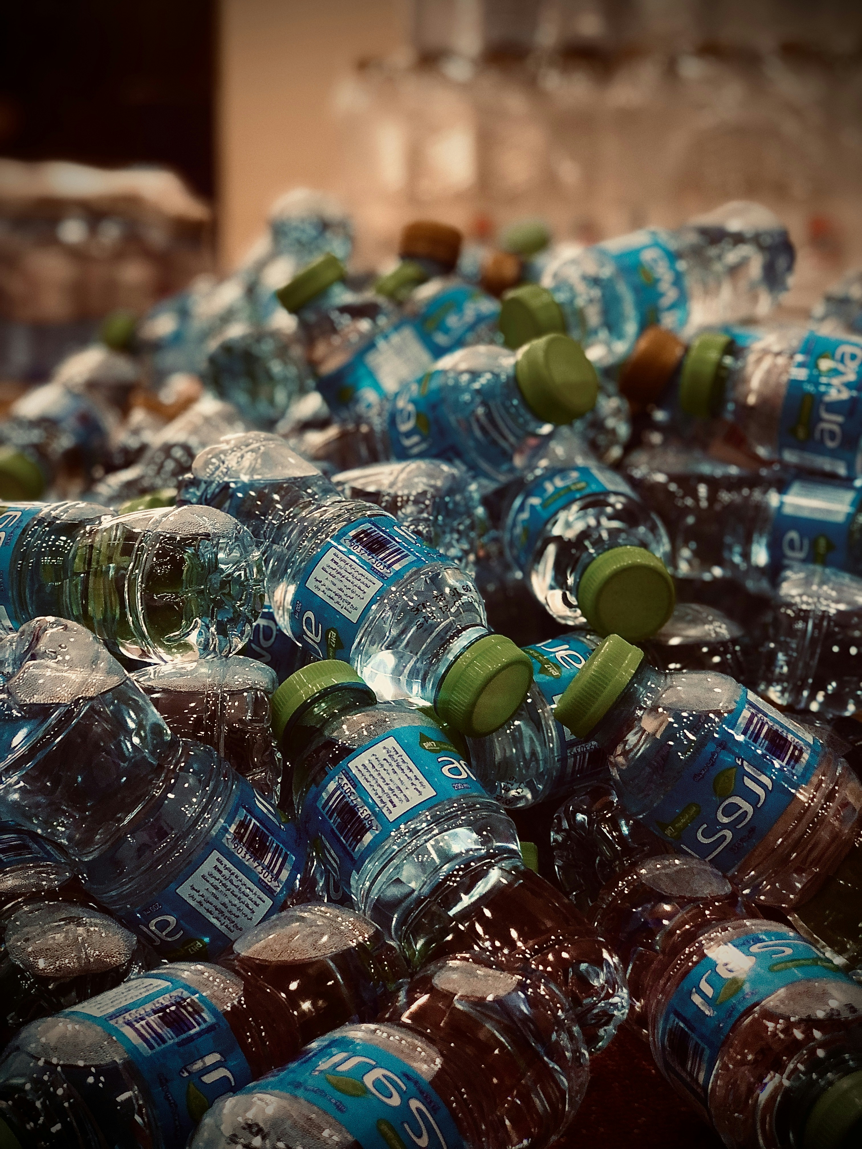 A pile of bottled water bottles sitting next to each other photo – Free ...