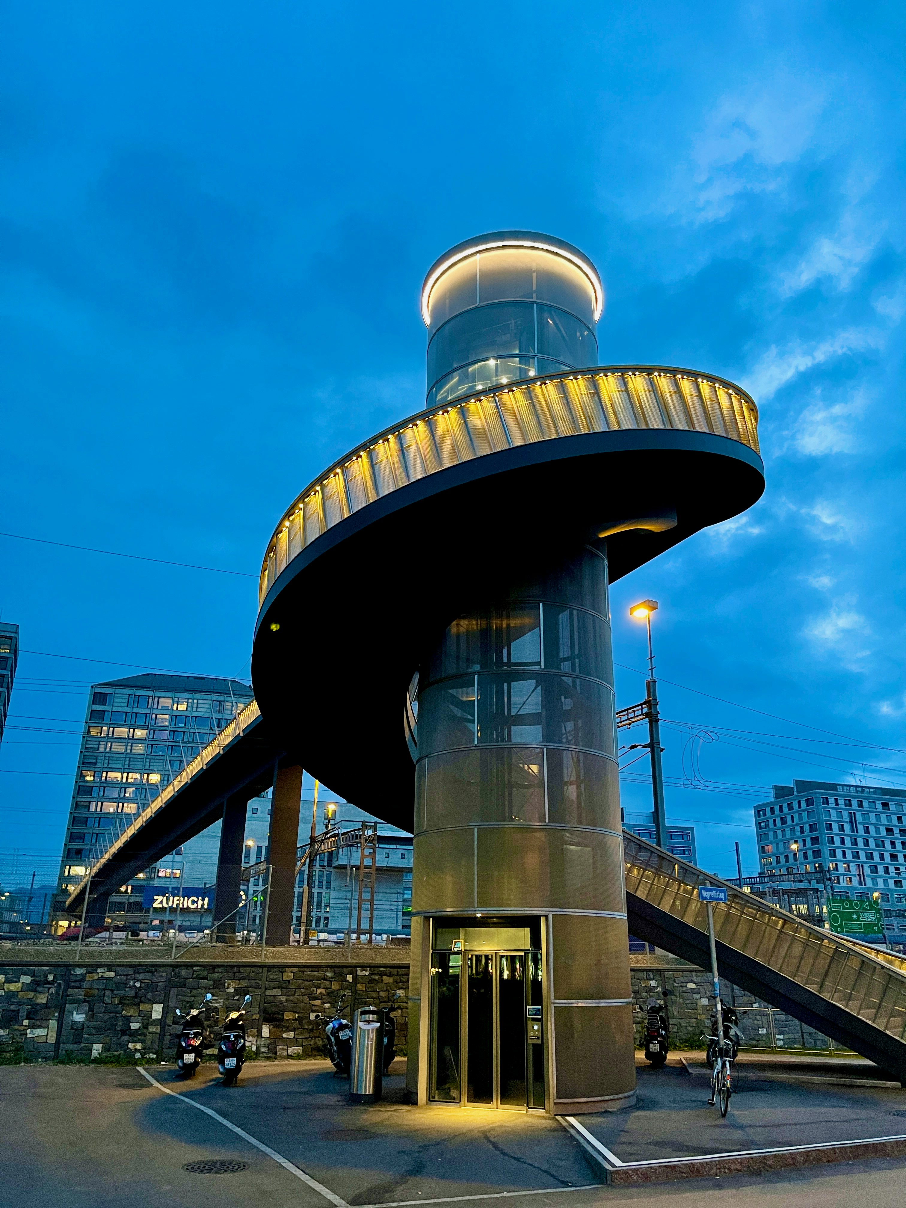 Twilight Spiral: Neon Ring Elevates a Glass Tower