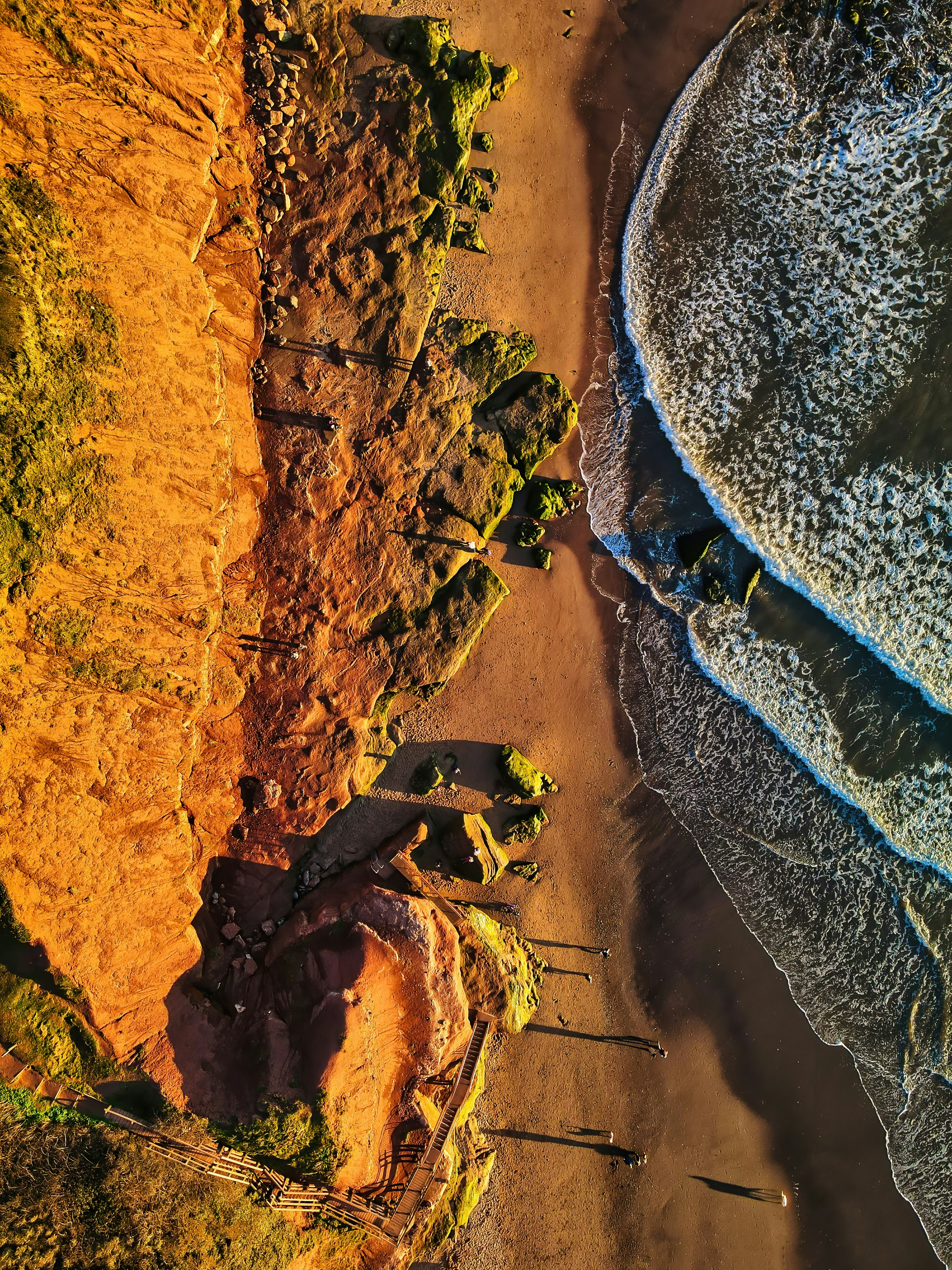 An aerial view of a beach and ocean photo – Free Orcombe point Image on ...