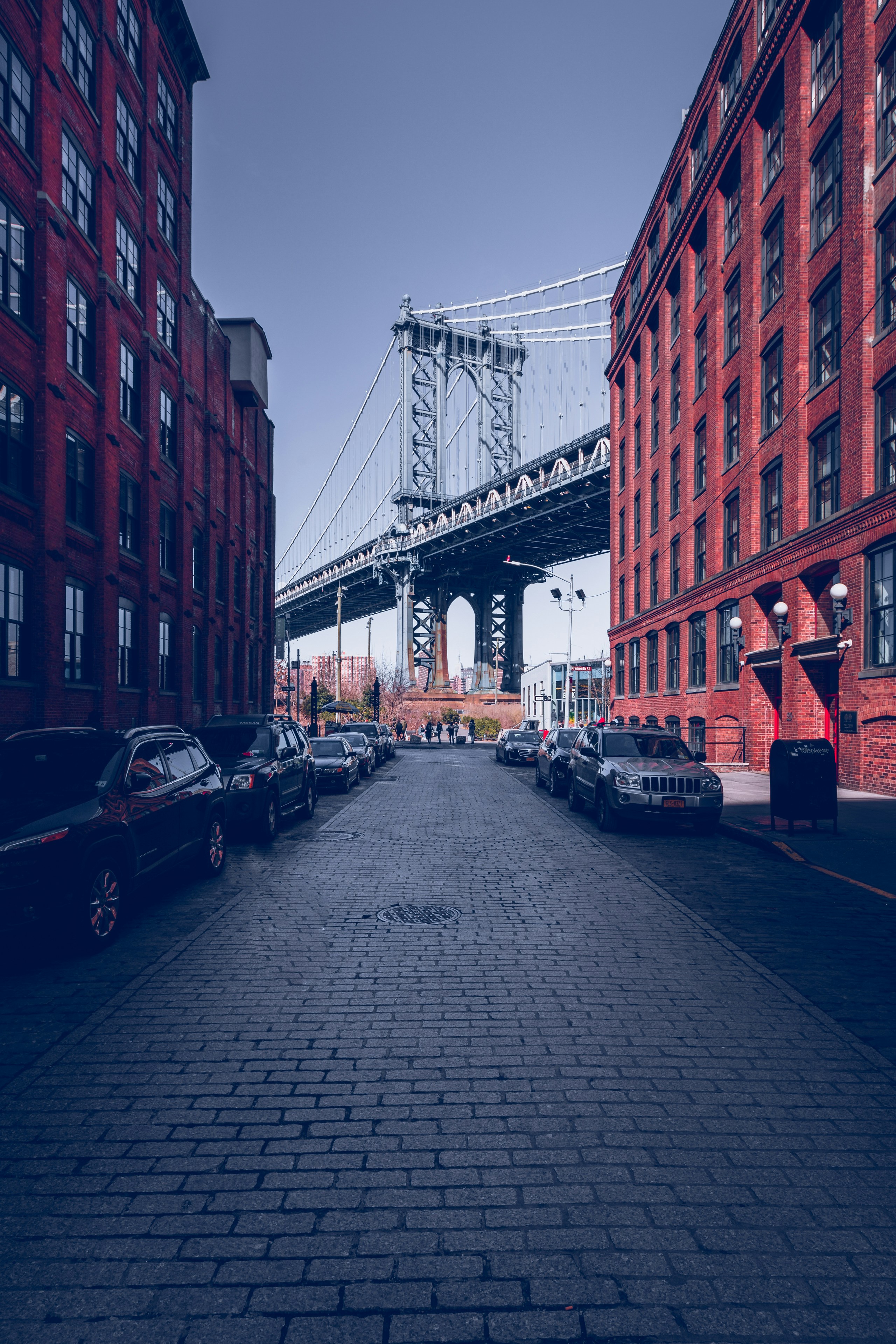 A city street with a bridge in the background photo – Free Bridge Image ...