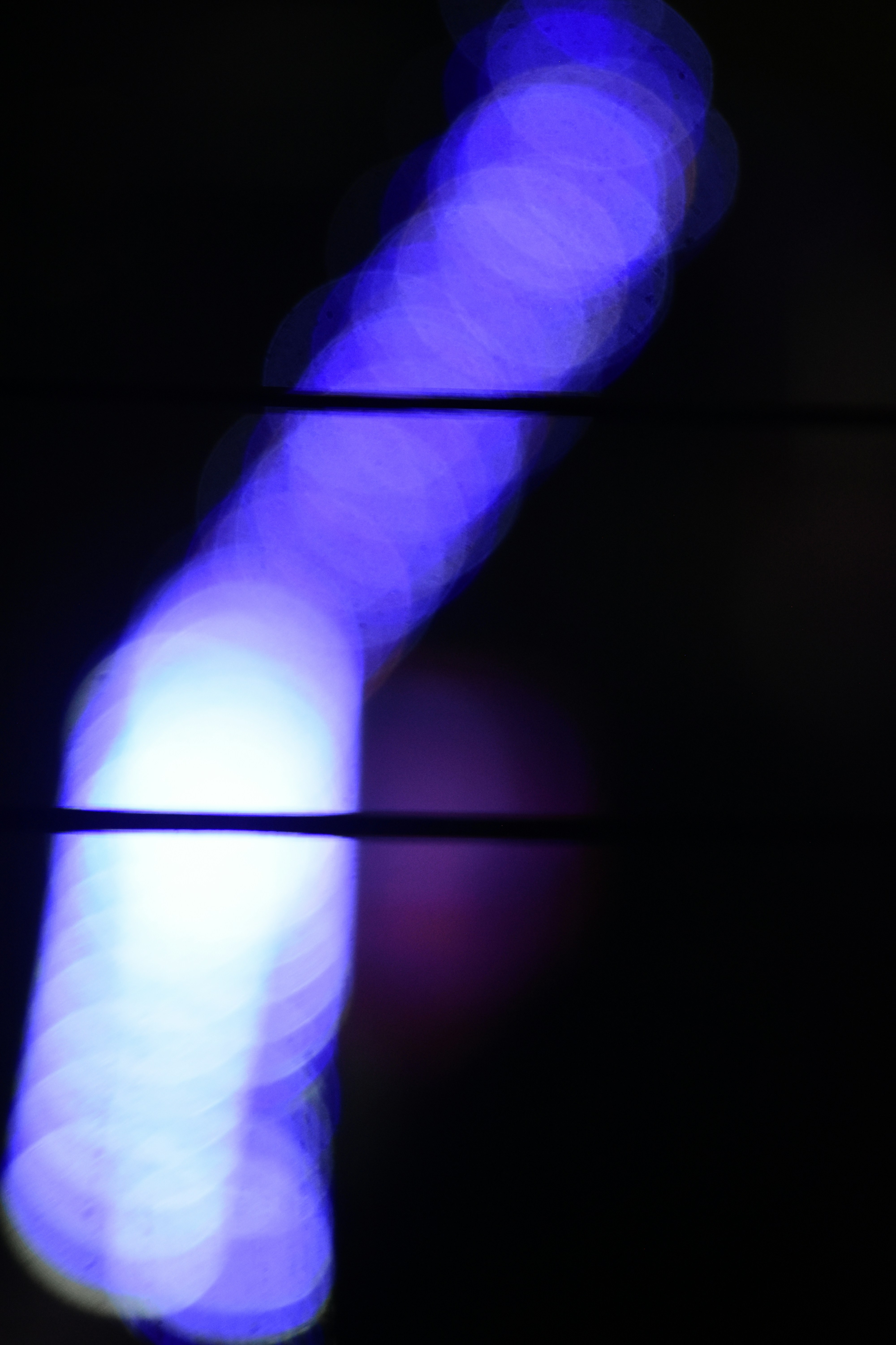Blue Bokeh Cascade Through Window Blinds