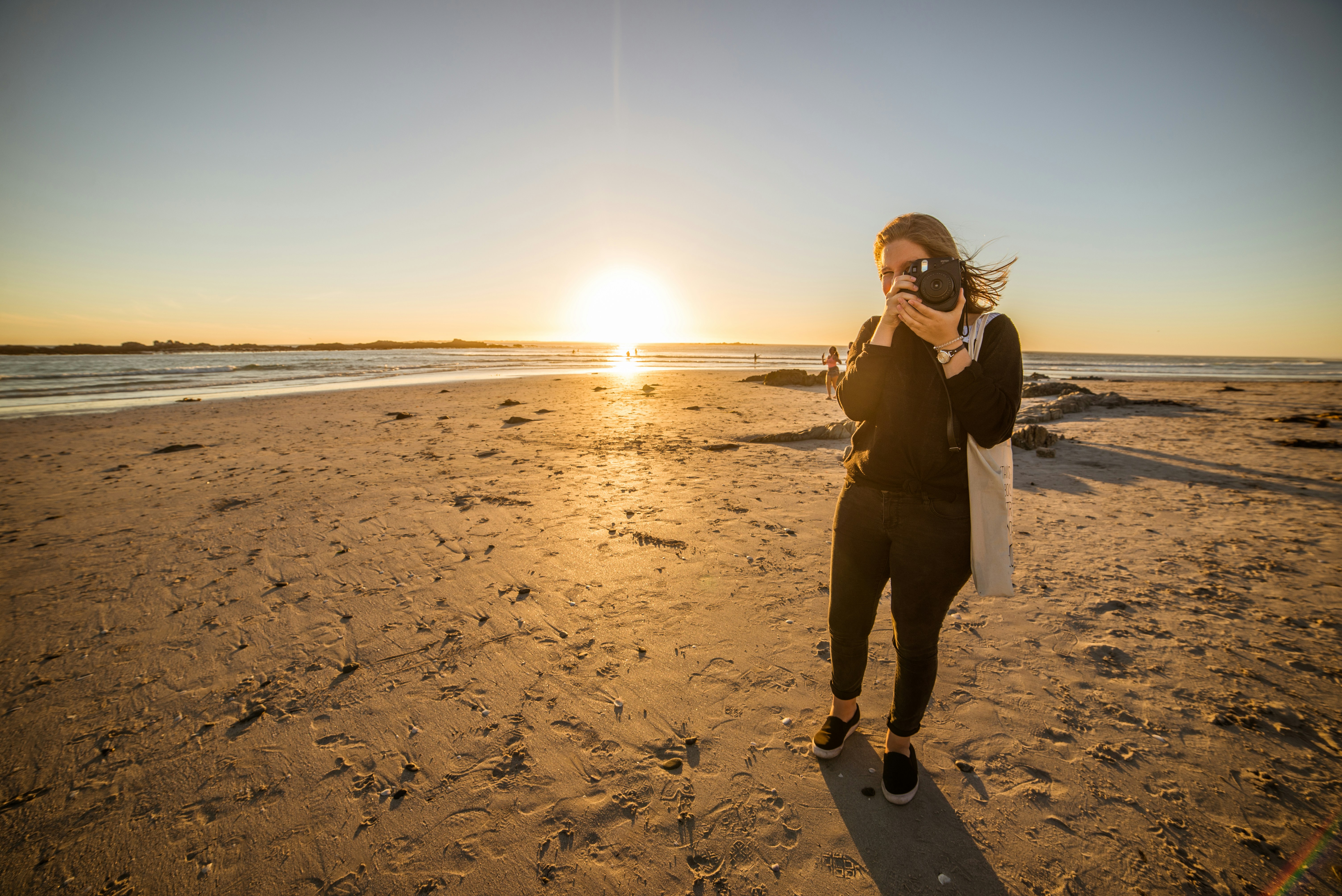 Sunlit Beach Portrait: Capturing a Photographer at Dusk