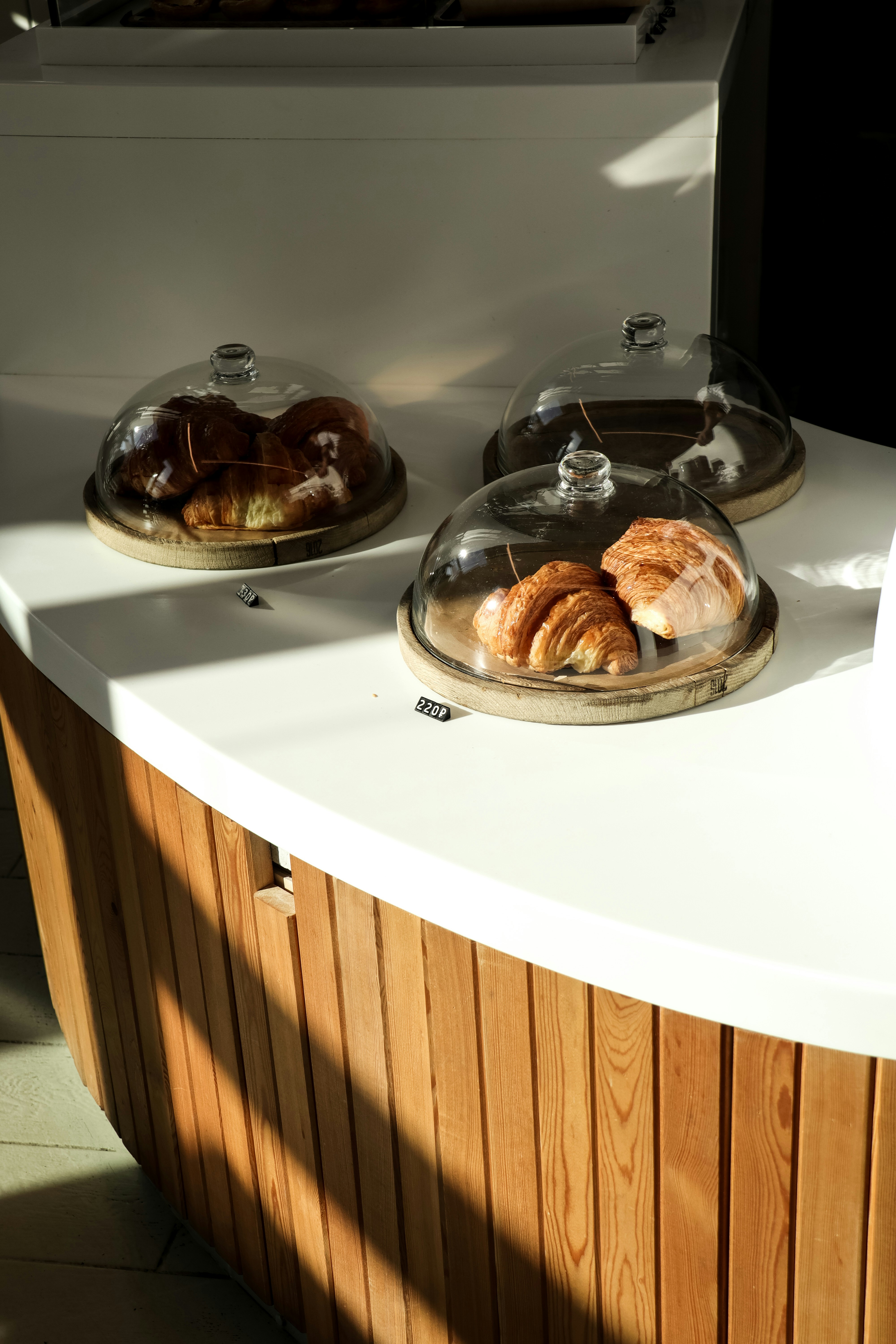 a couple of trays of food sitting on top of a counter