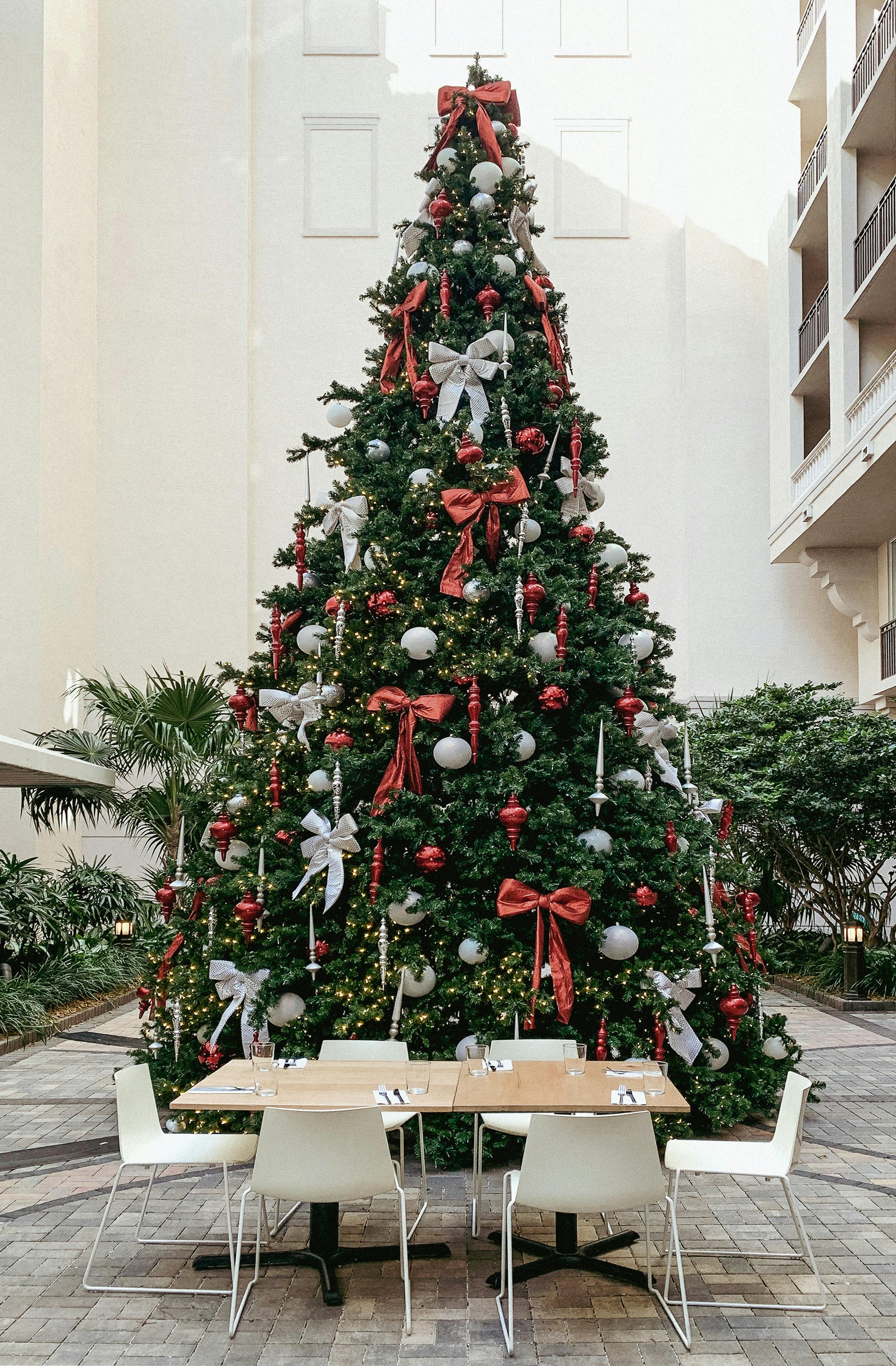 a decorated christmas tree in a hotel lobby