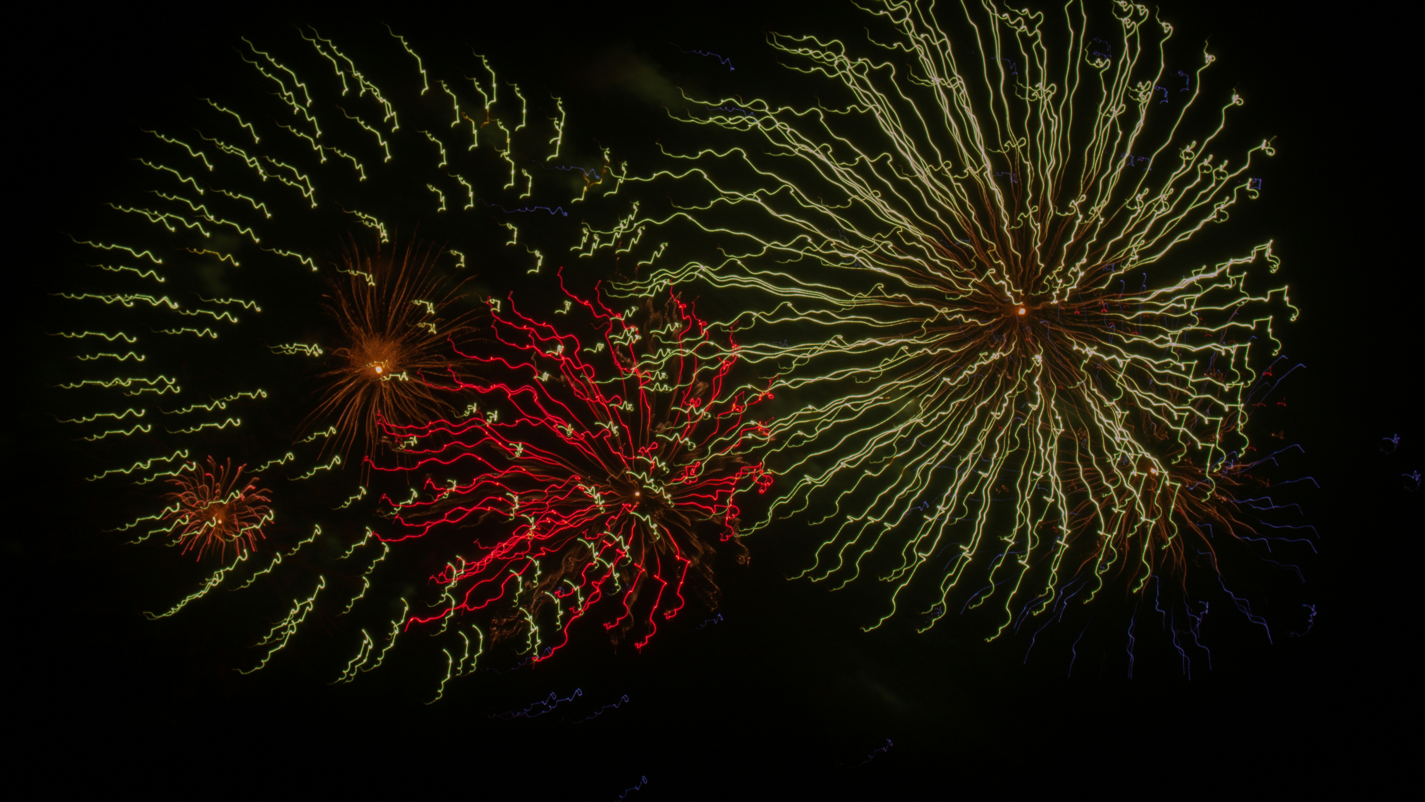 A couple of fireworks are lit up in the night sky photo – Free ...