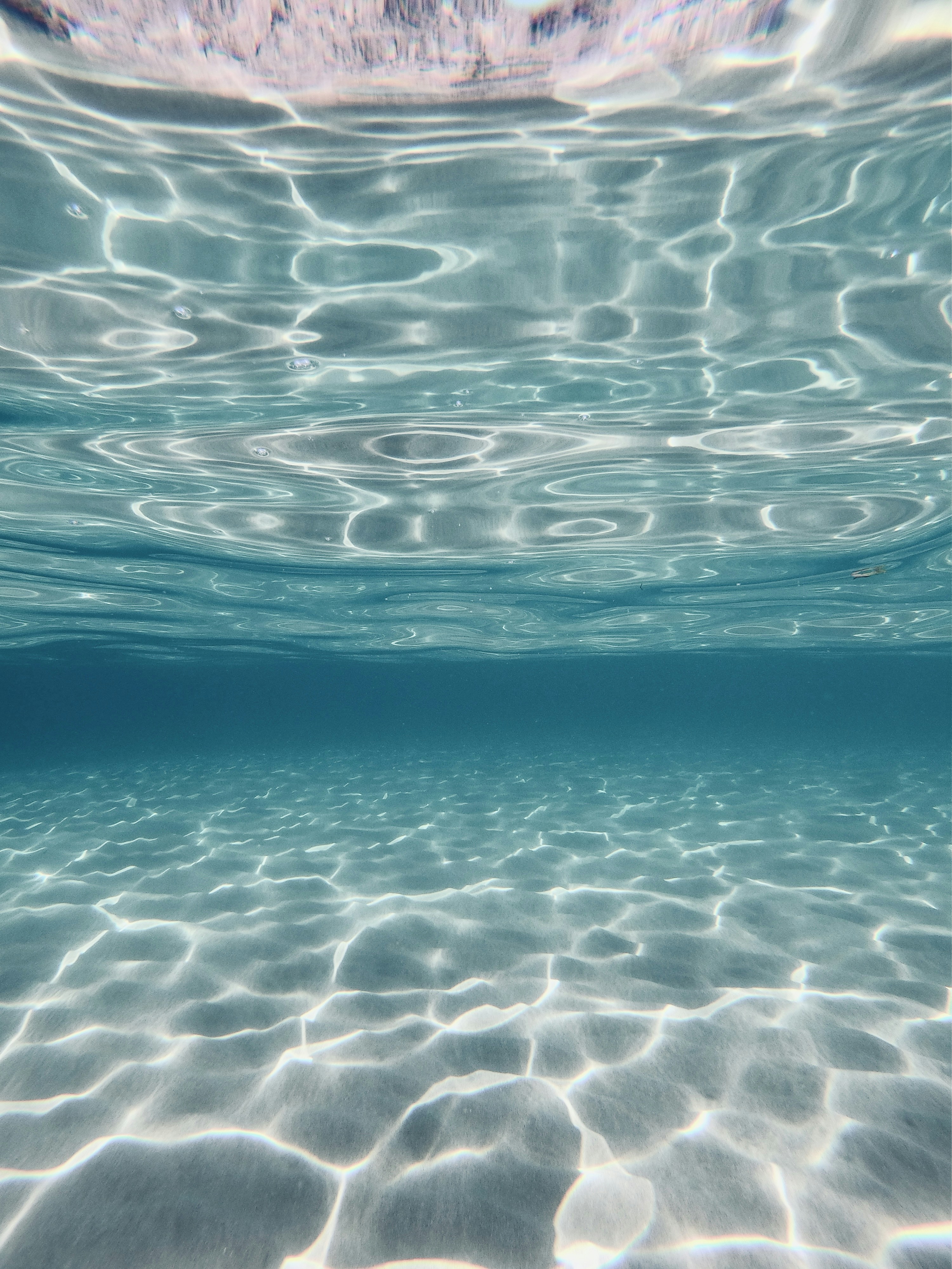 An underwater view of a pool with clear water photo – Free Blue Image ...