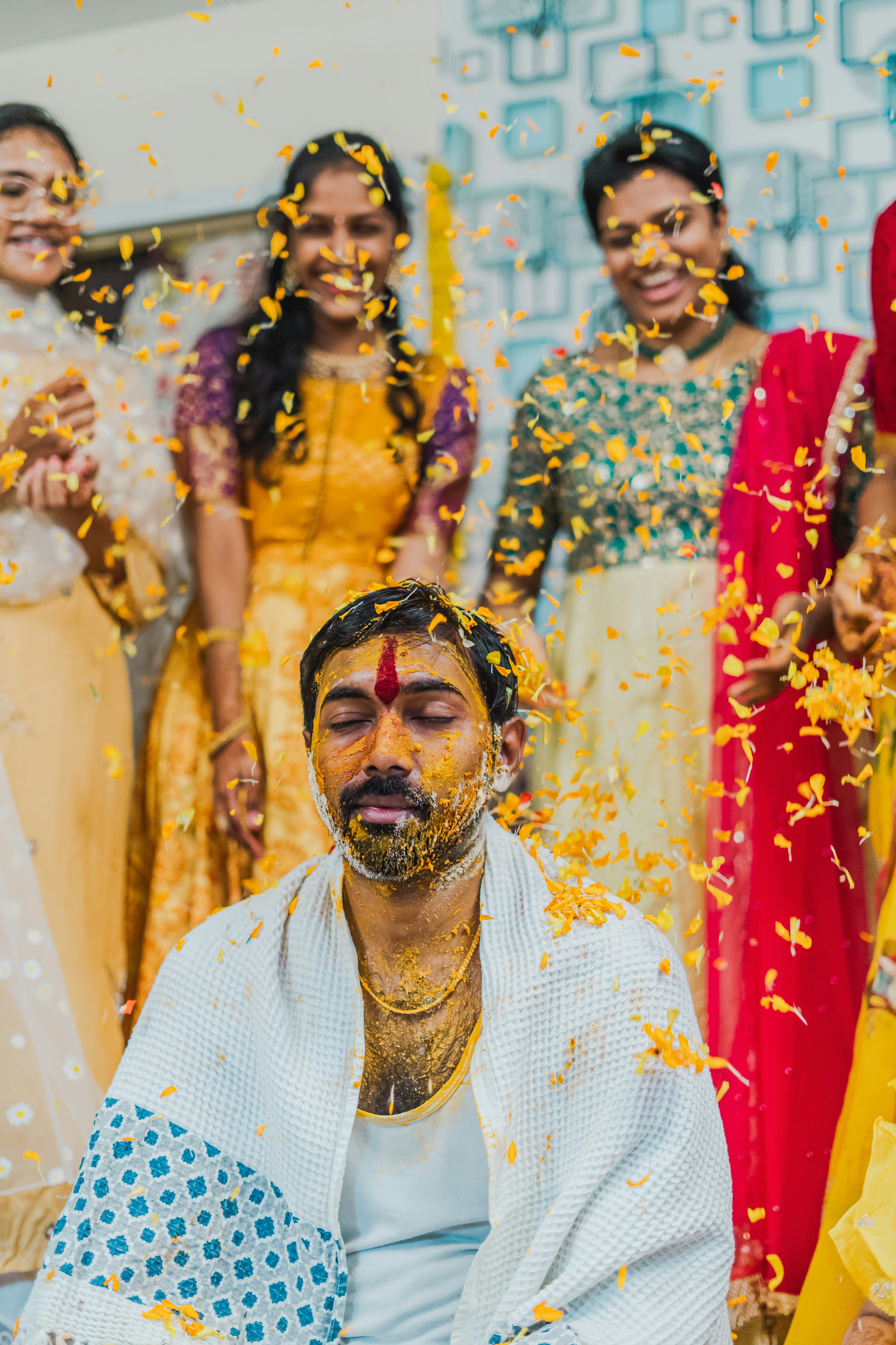 Center Stage in Yellow Confetti: A Quiet Breath Amid a Colorful Celebration